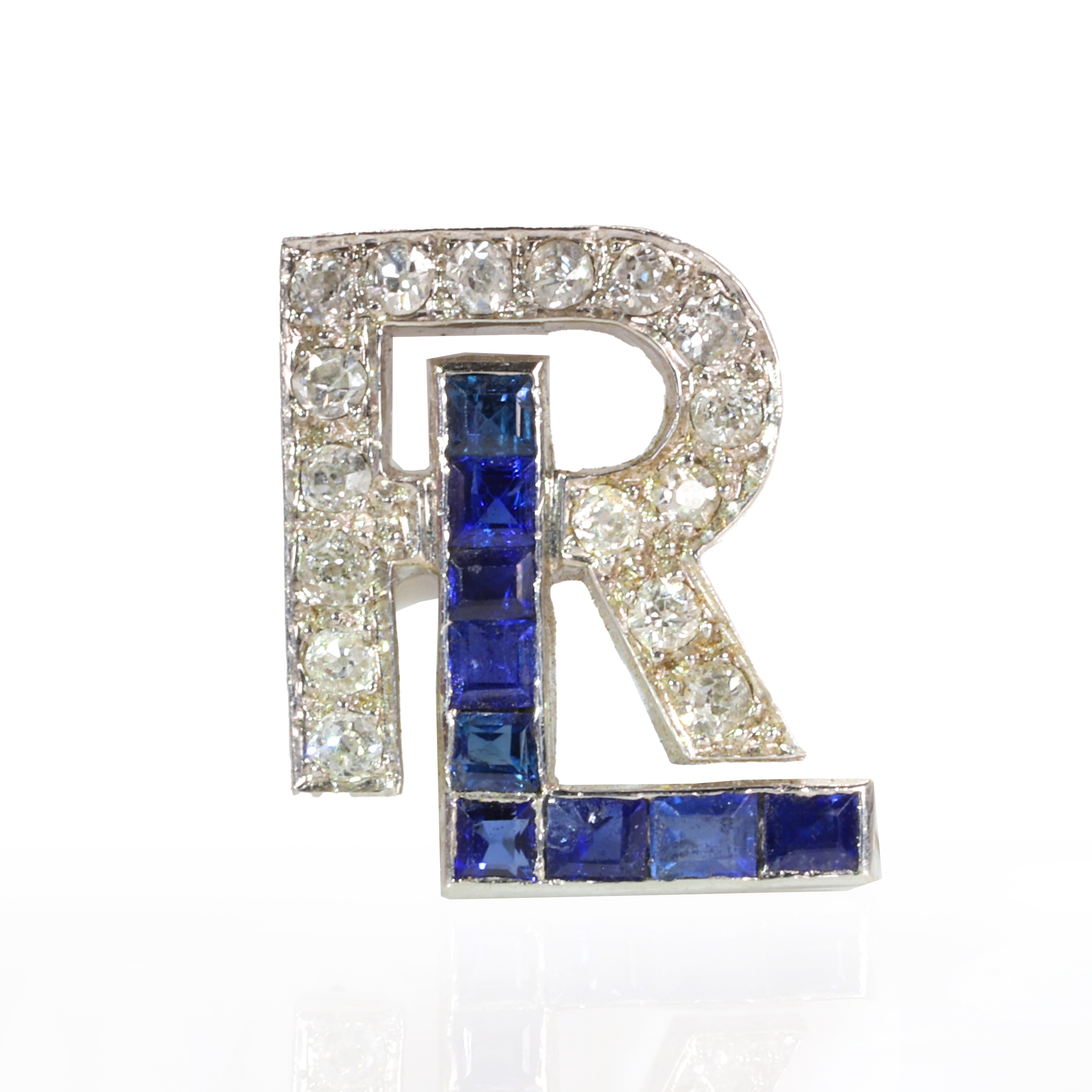 Lot 67 - An Art Deco sapphire and diamond monogram,