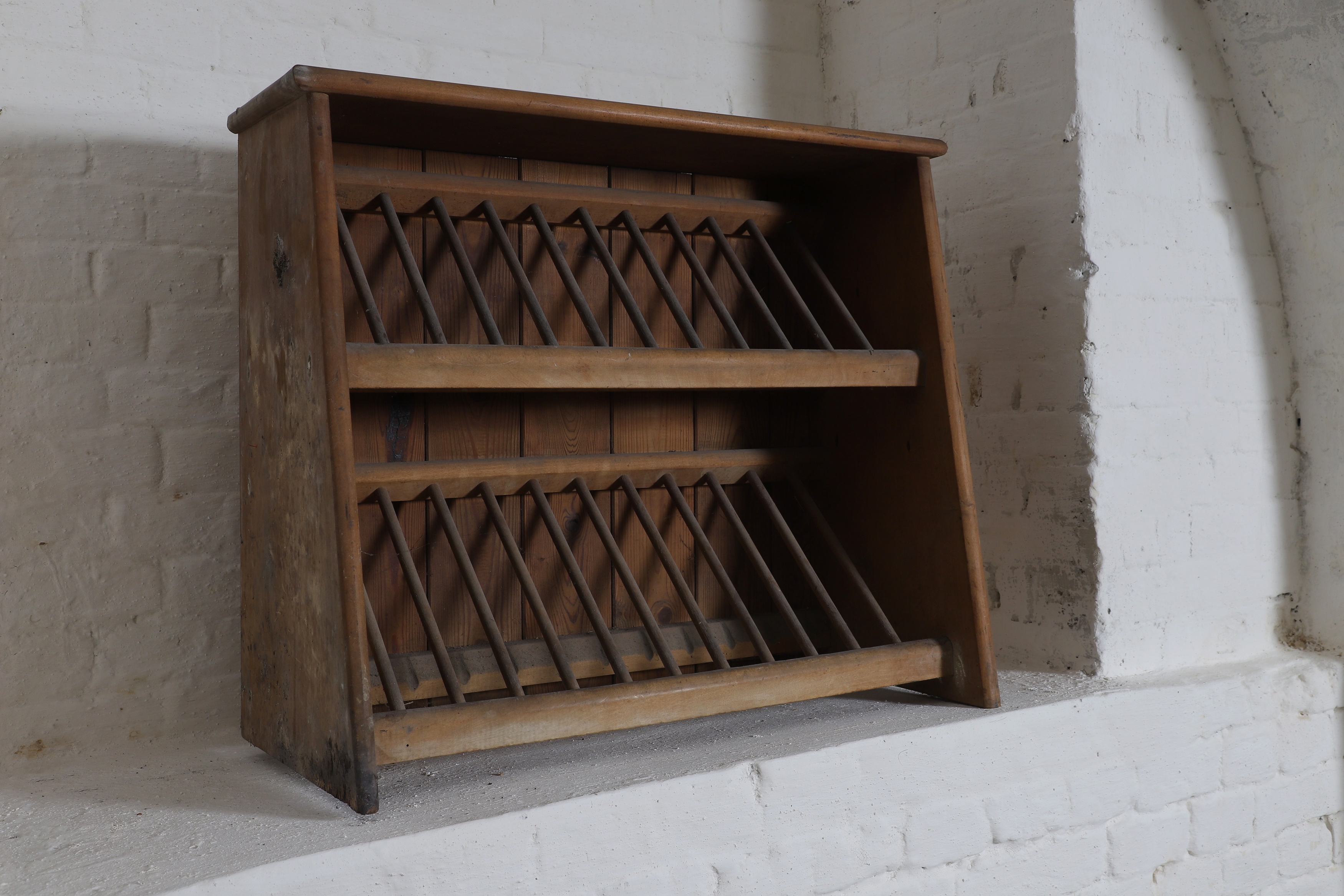 Lot 346 - A wall-mounted beech plate rack,