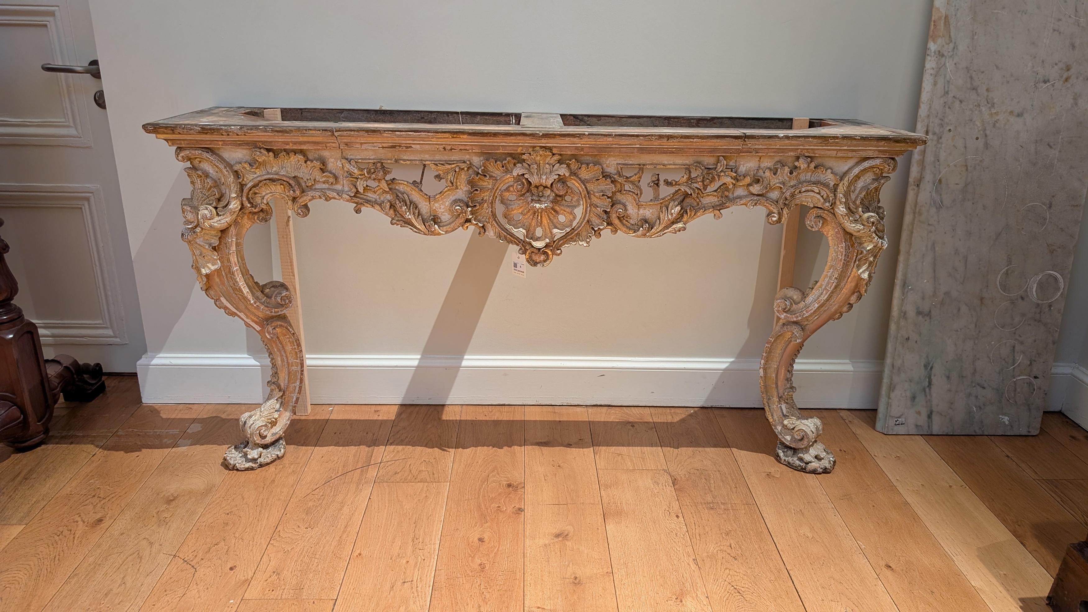 Lot 6 - A George II carved and gilt console table,