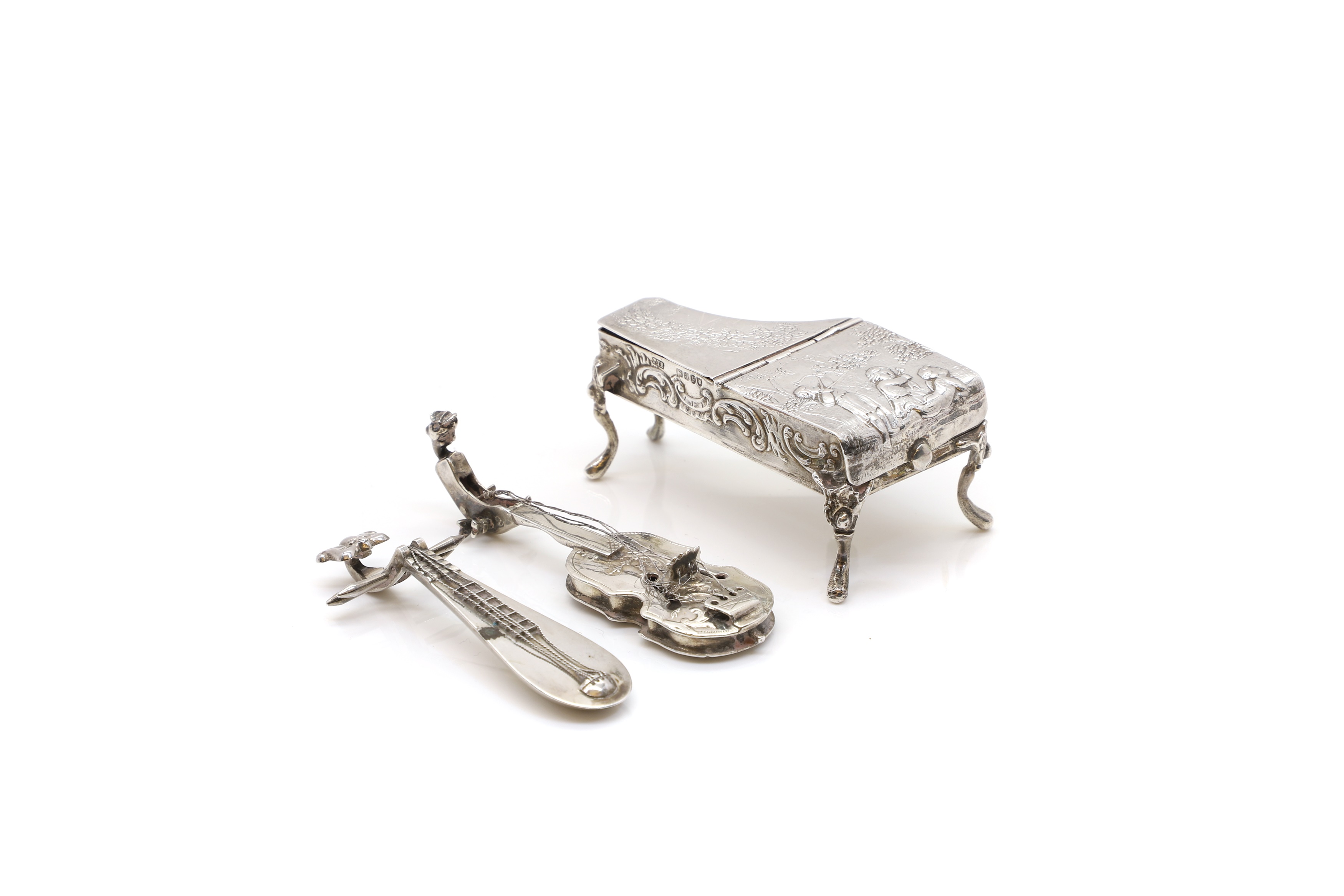 Lot 28 - A group of silver novelty musical instruments