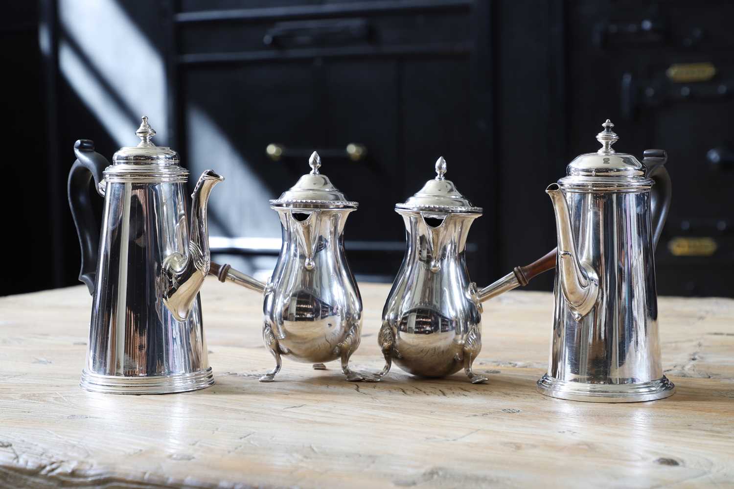 Lot 245 - Two silver-plated coffee pots,