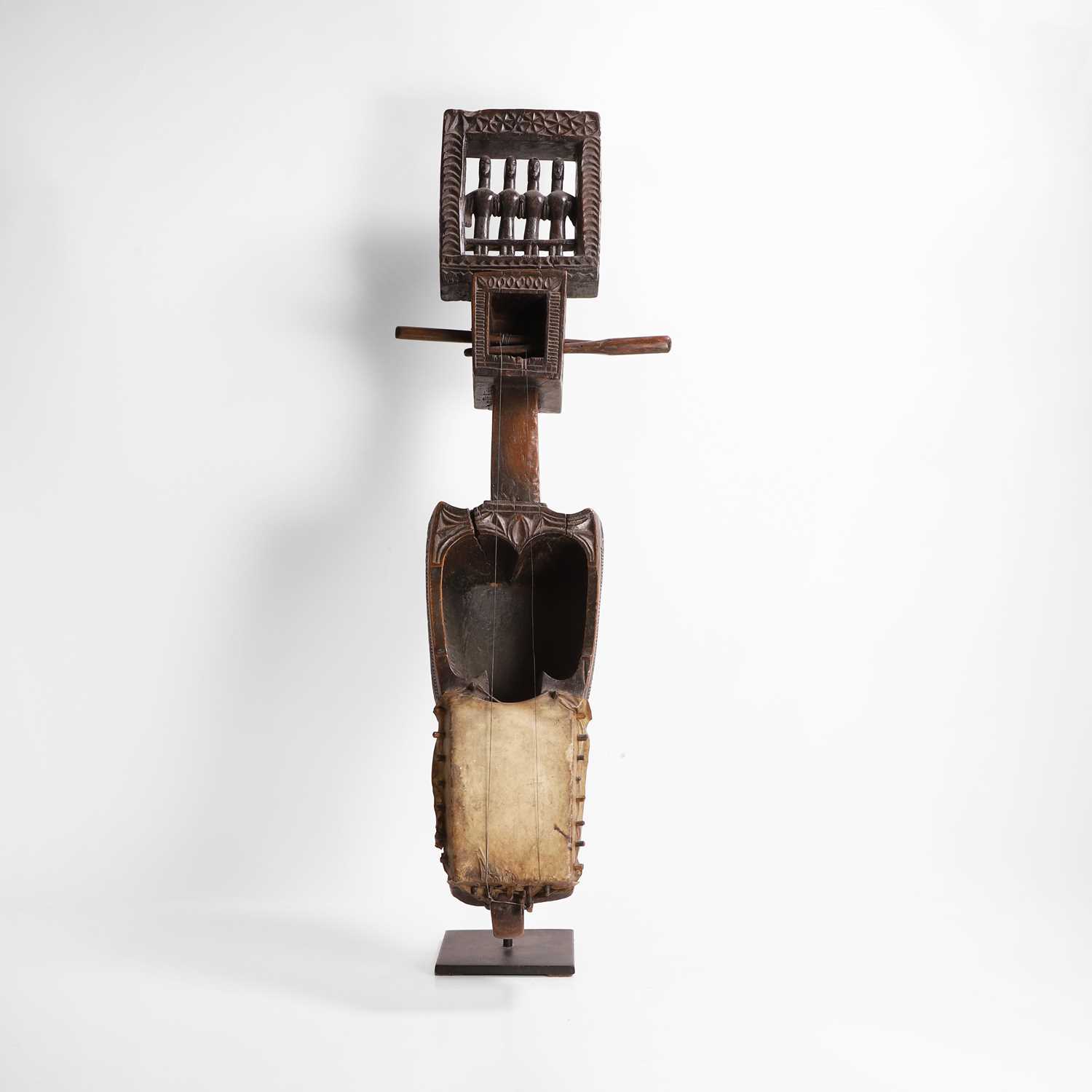 Lot 417 - A carved wooden and hide 'dhodro banam' lute,