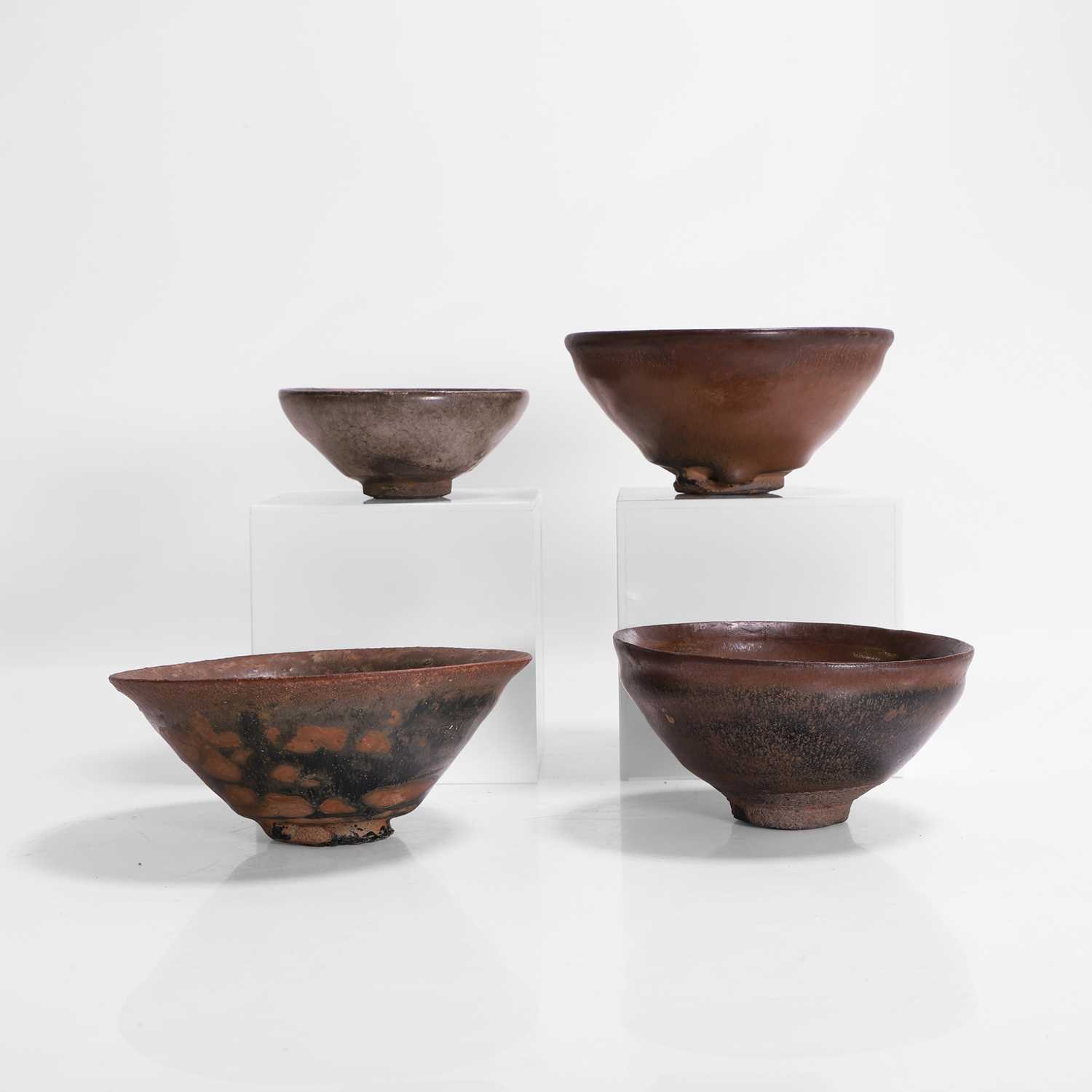 Lot 363 - A collection of four Jian ware tea bowls,