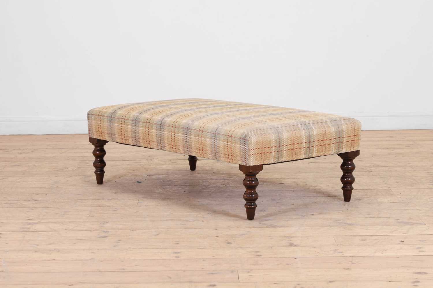 Lot 62 - An upholstered footstool by George Smith,
