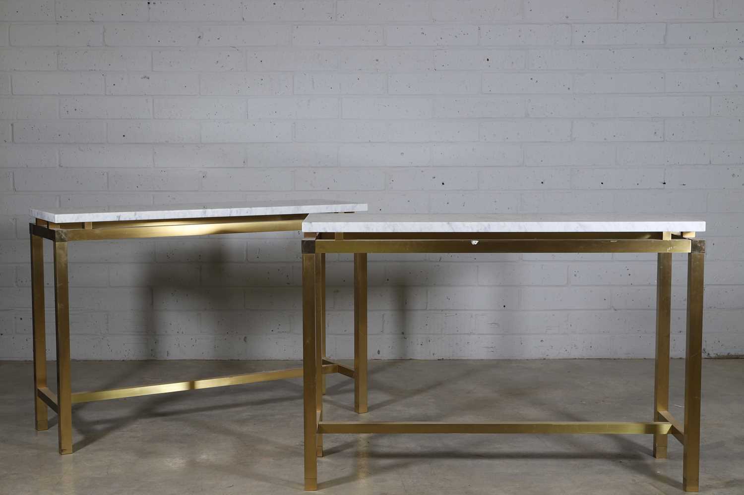 Lot 735 - A pair of brass and marble console tables,