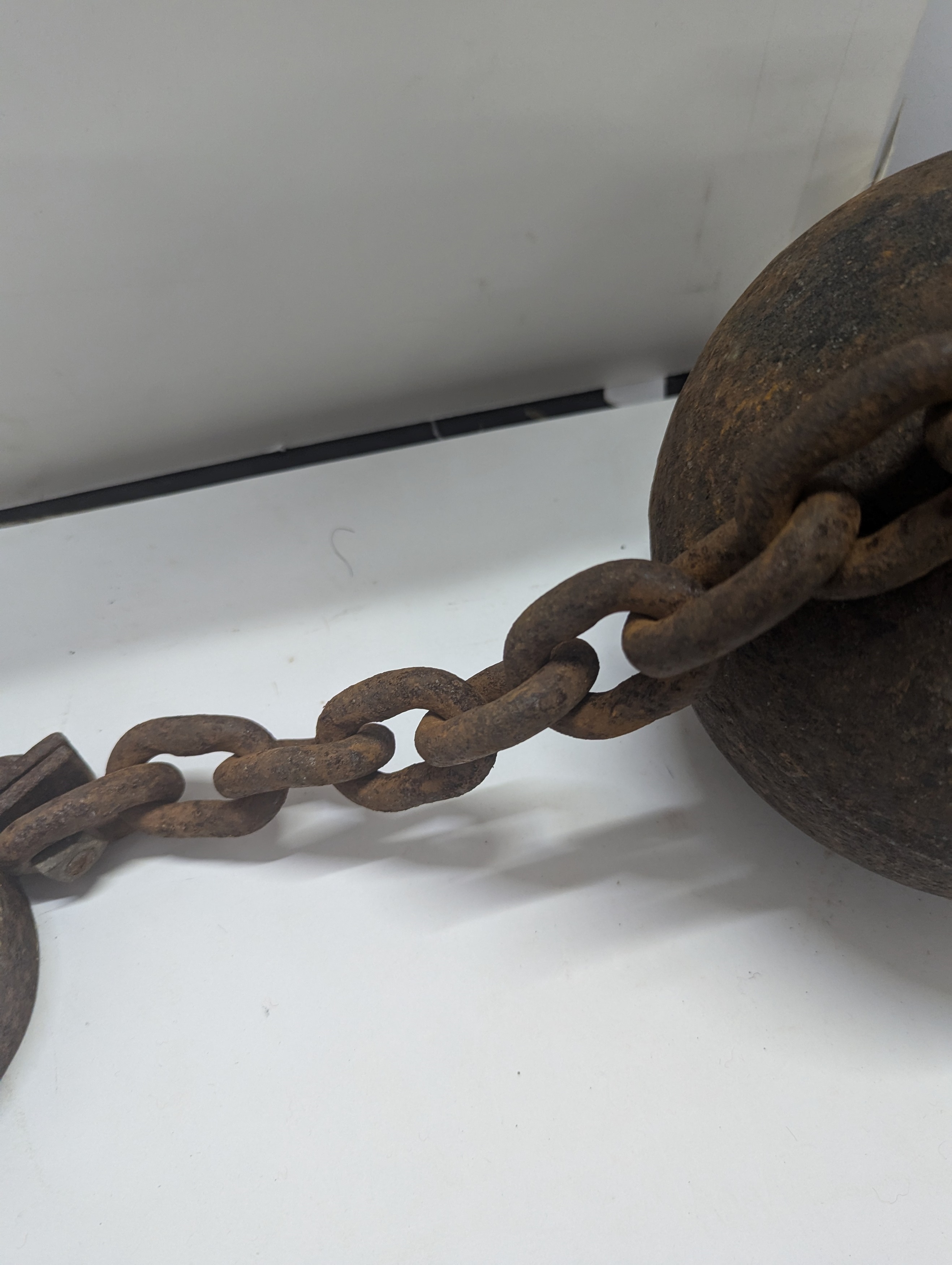 Lot 364 - A cast iron ball and chain,
