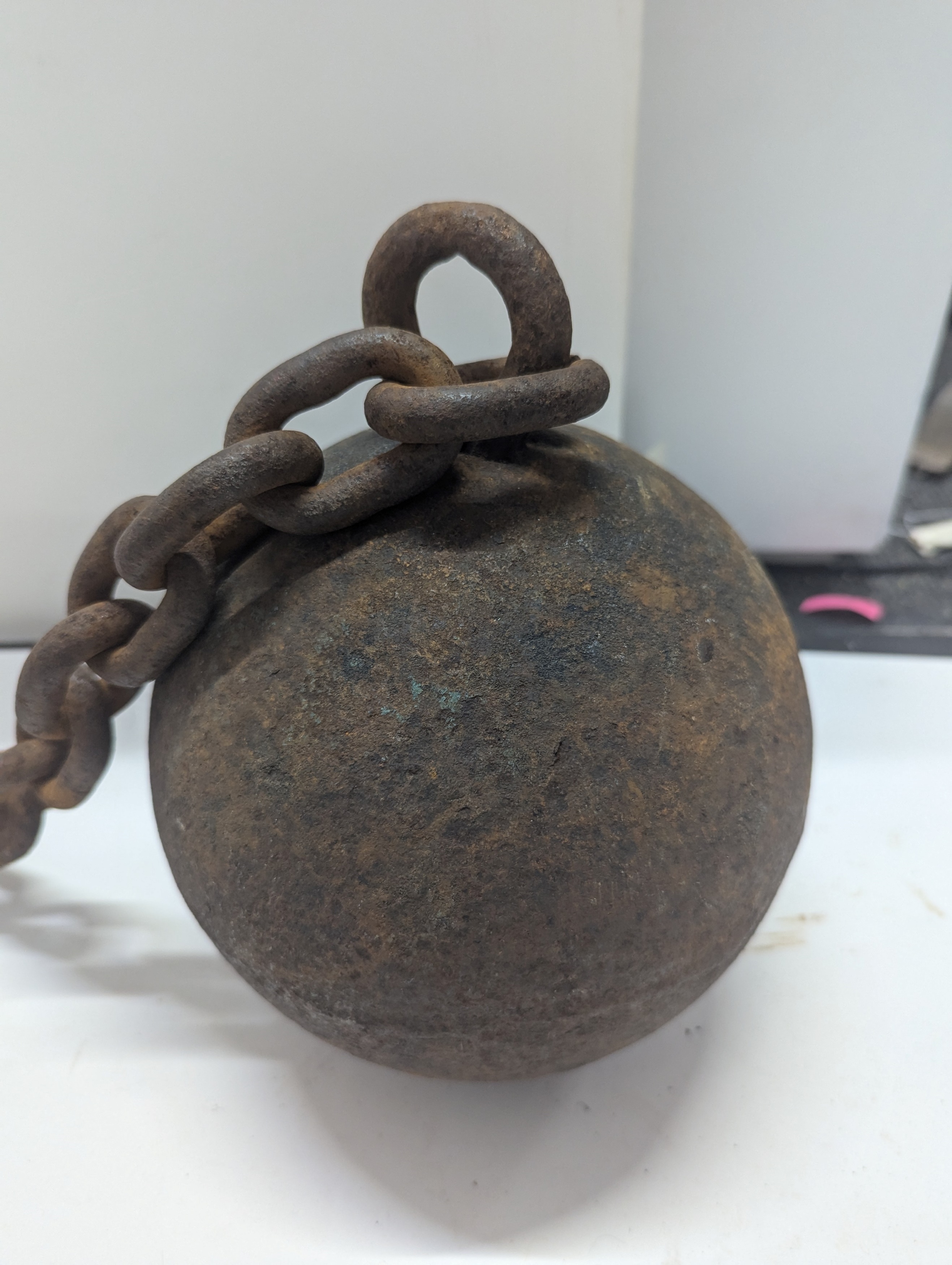 Lot 364 - A cast iron ball and chain,