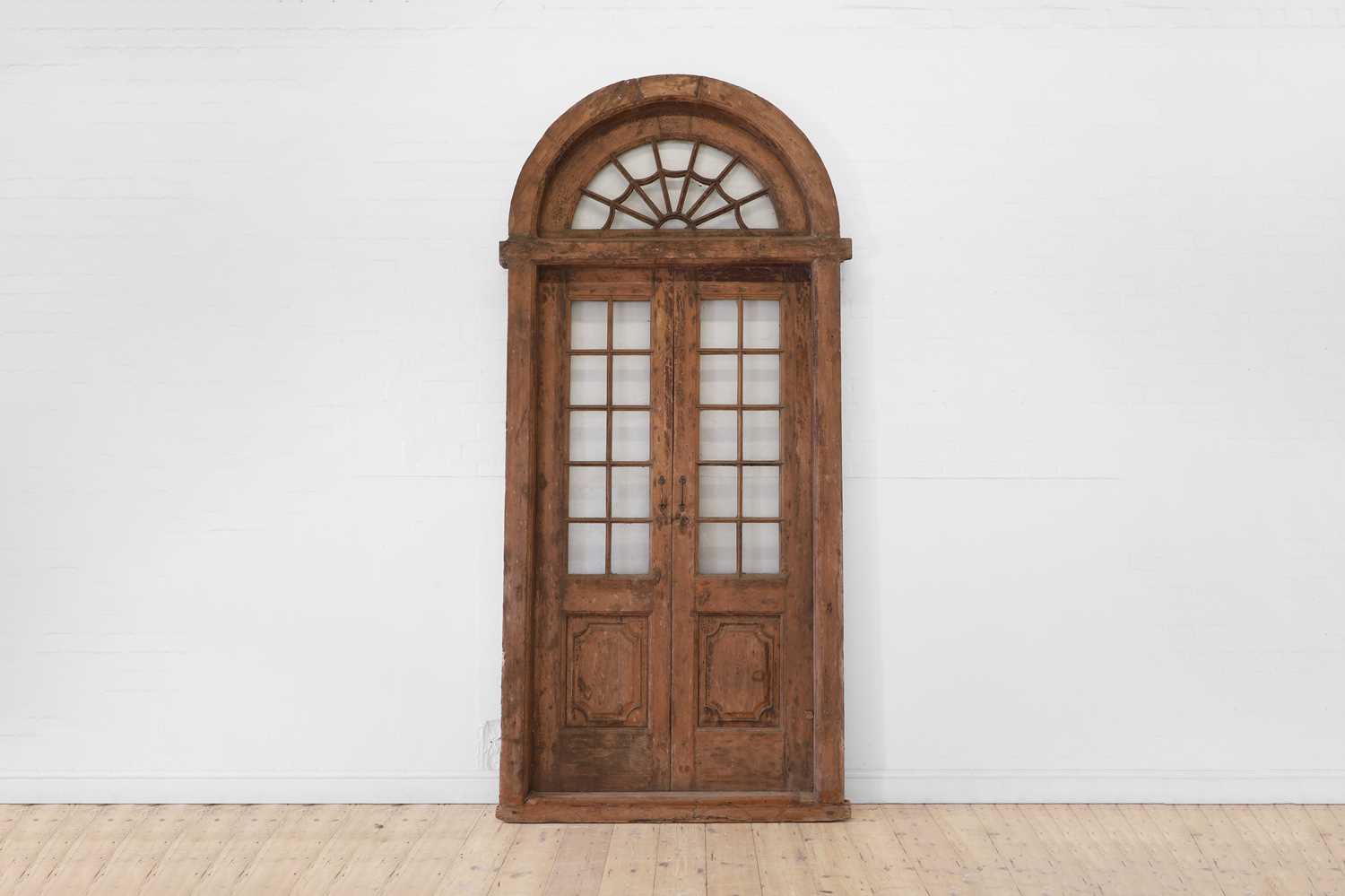 Lot 582 - An Arts & Crafts panelled wooden door frame,