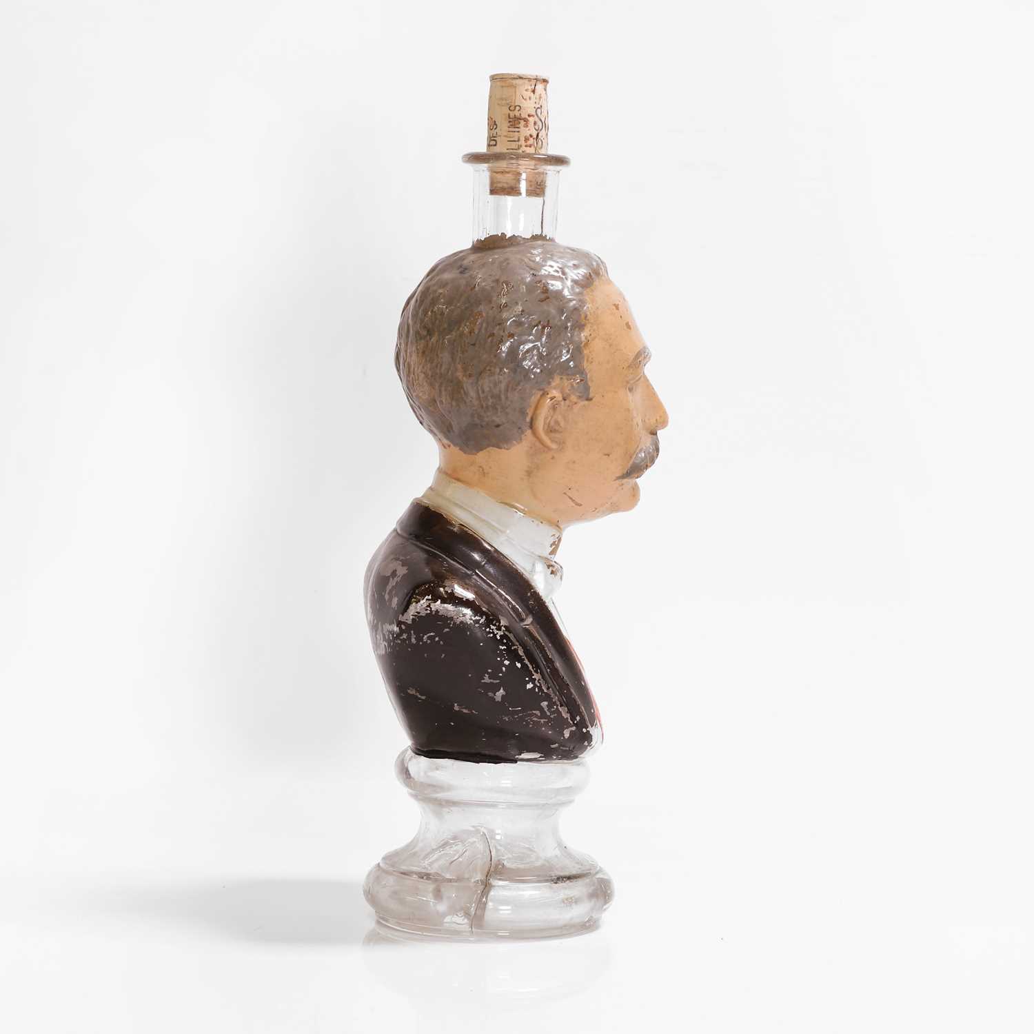 Lot 107 - A polychrome-painted glass figural bottle,