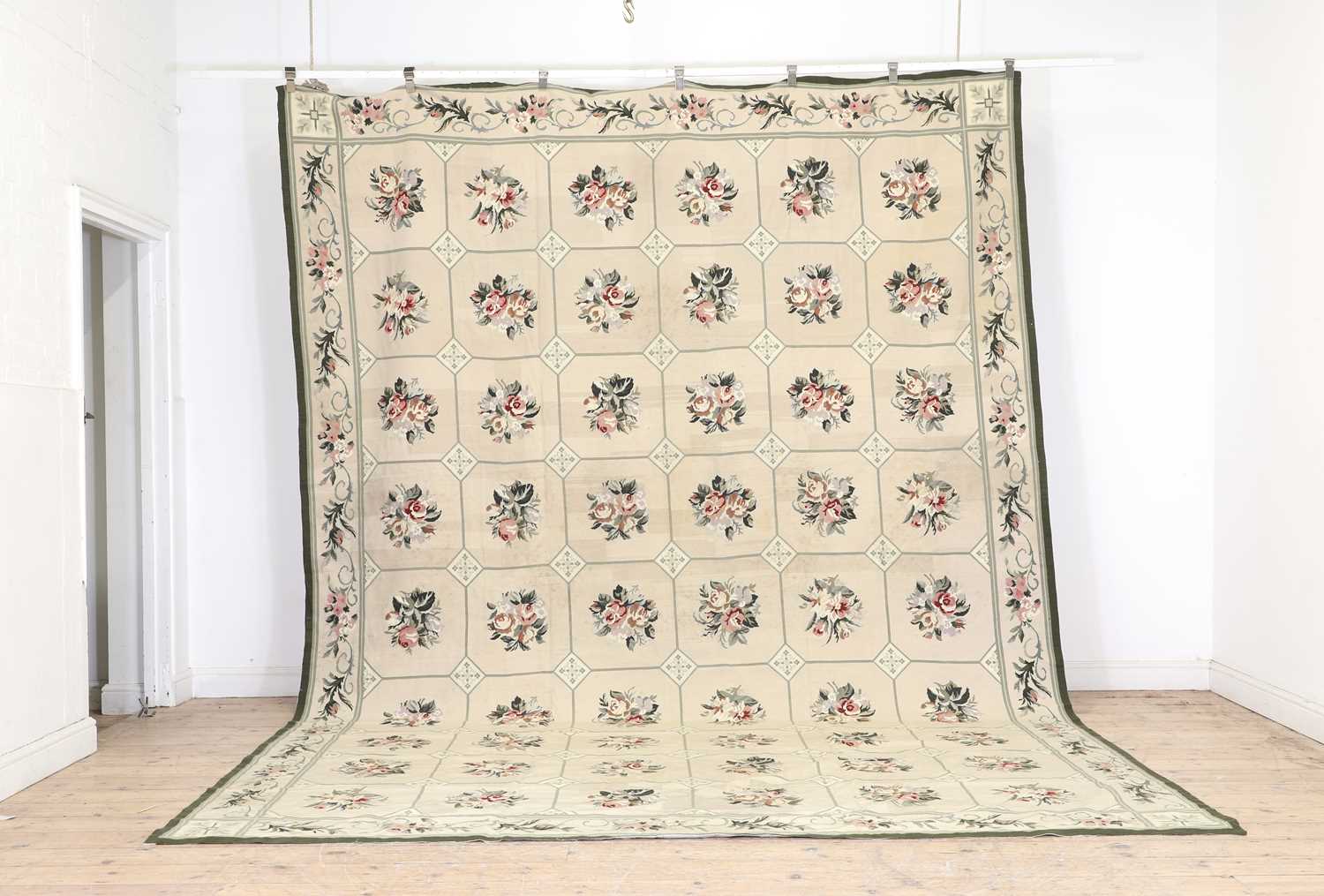 Lot 413 - A needlepoint carpet,