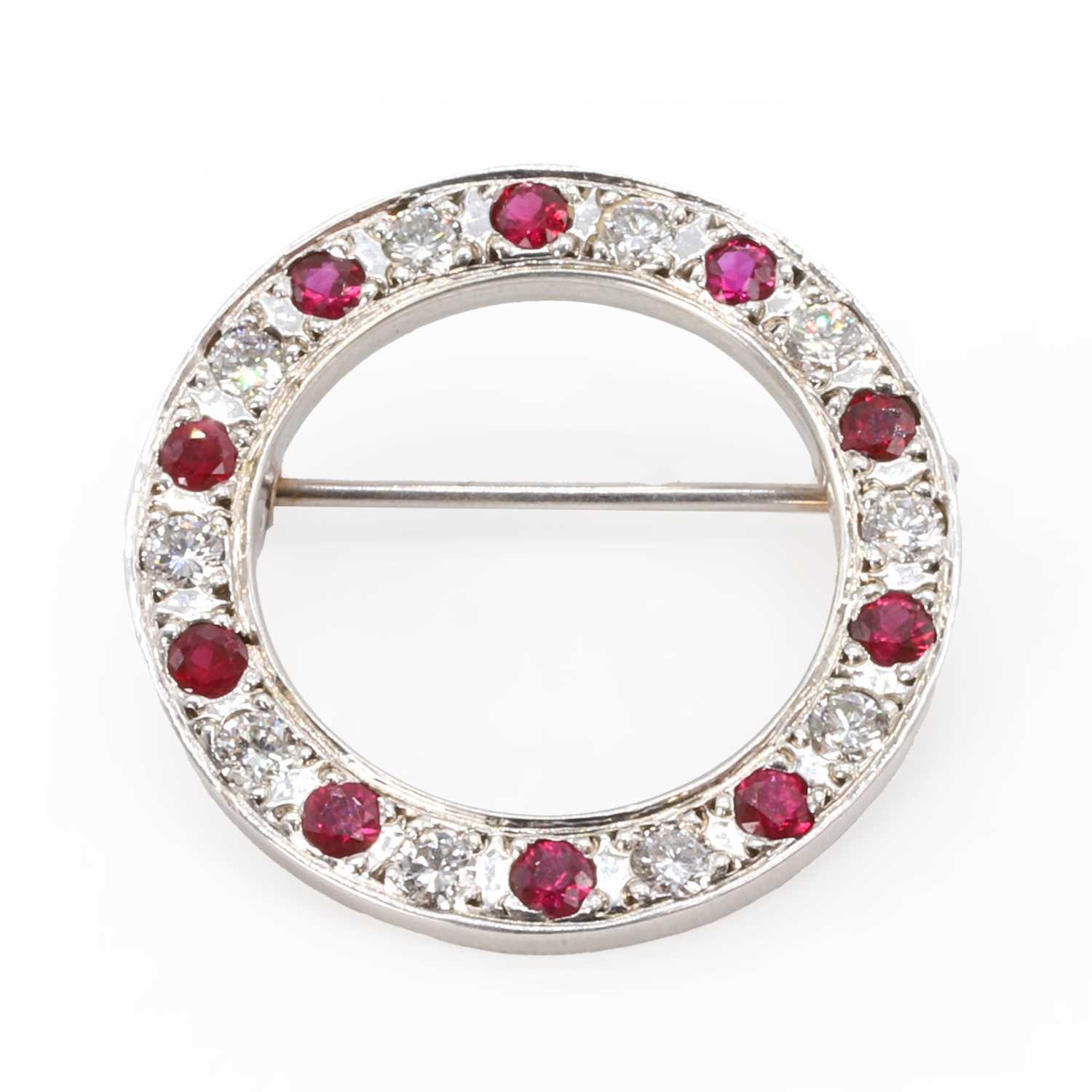 Lot 93 - A 9ct white gold ruby and diamond circle
