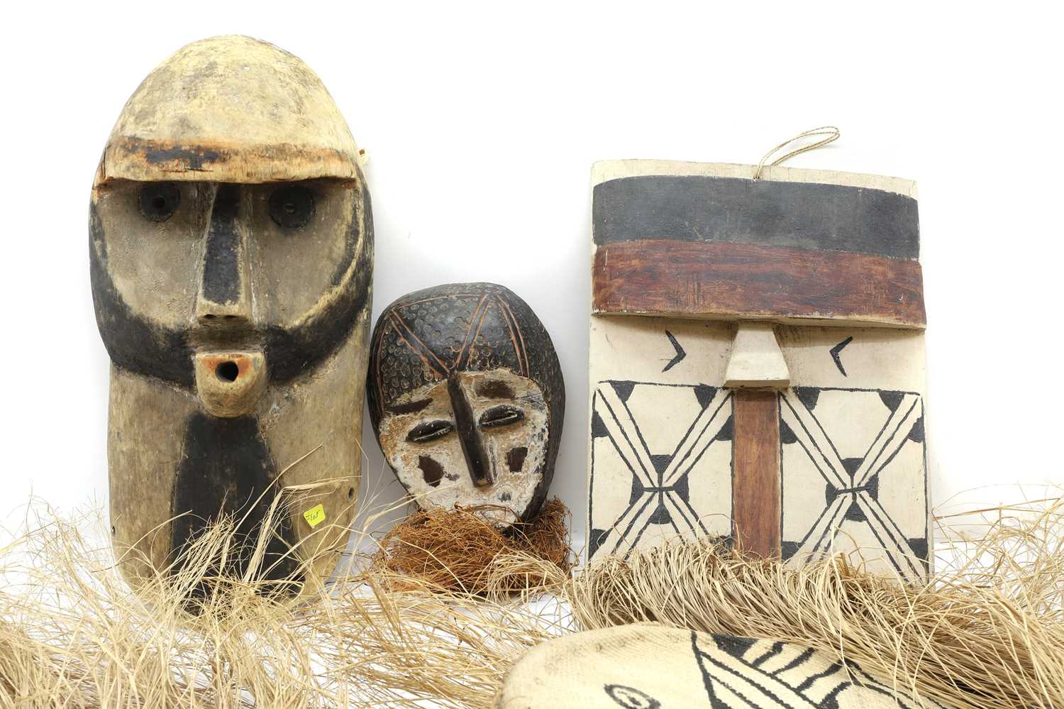 Lot 302 - A collection of tribal wood masks
