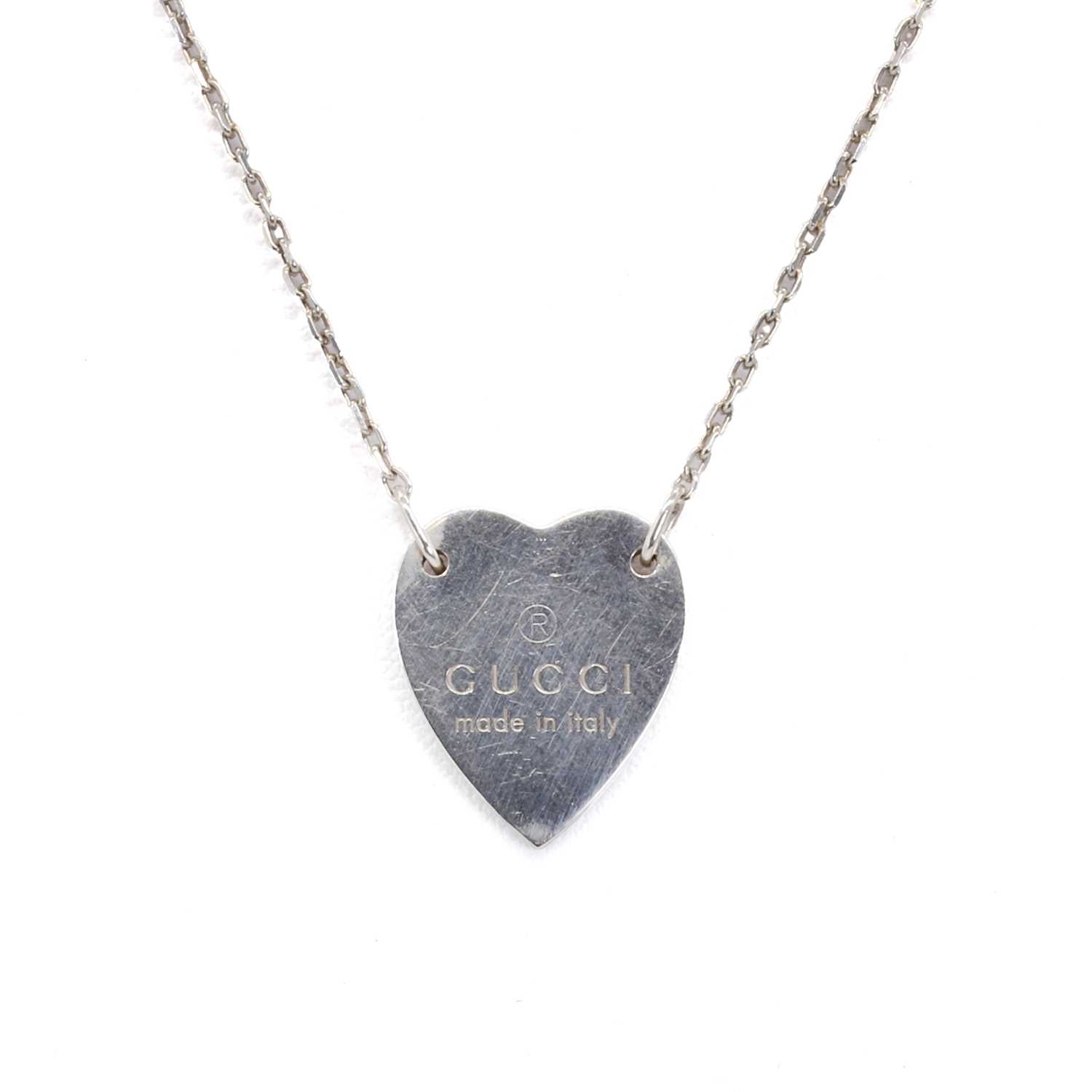 Lot 1268 - A Gucci heart pendant,