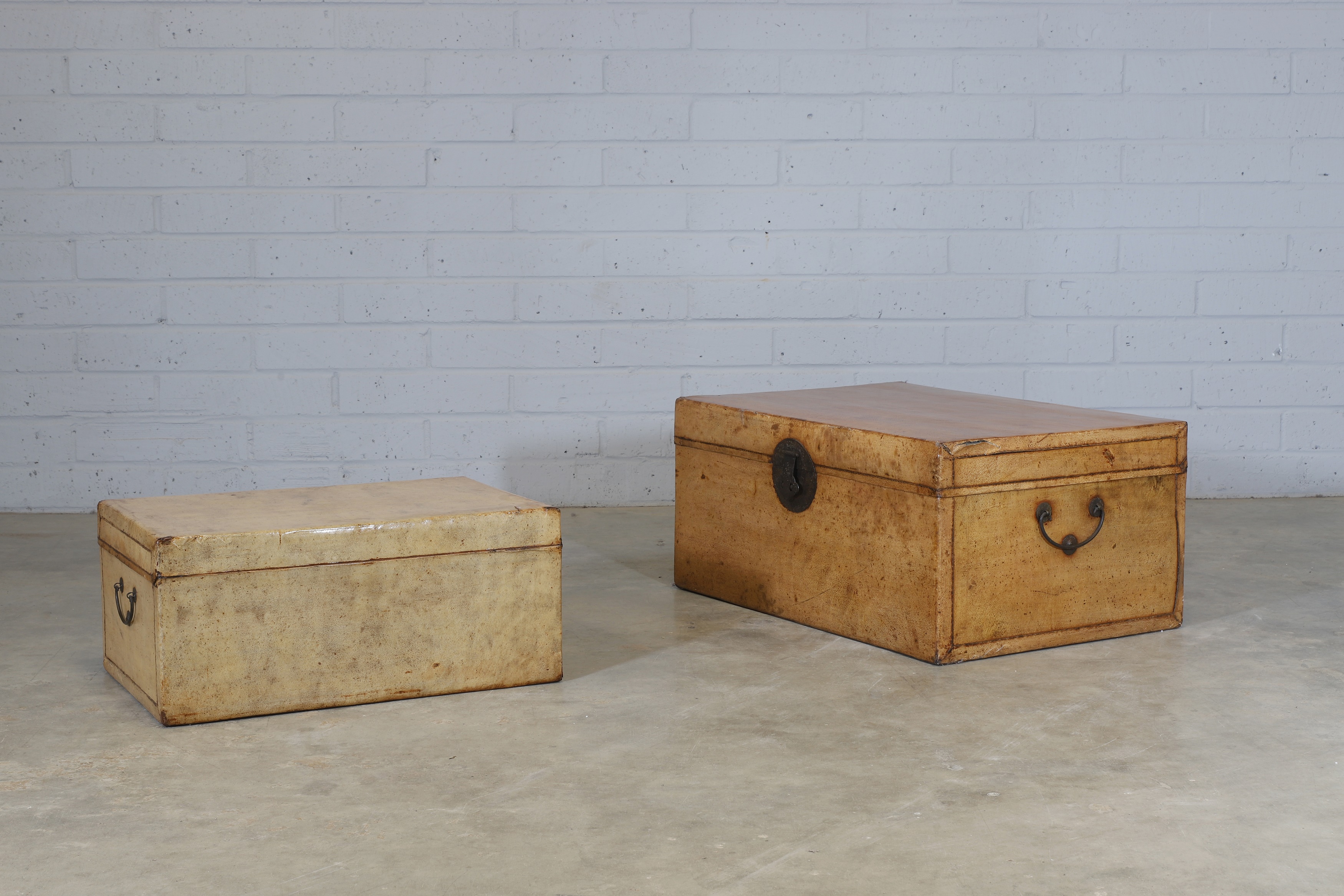 Lot 469 - Two vellum storage trunks,
