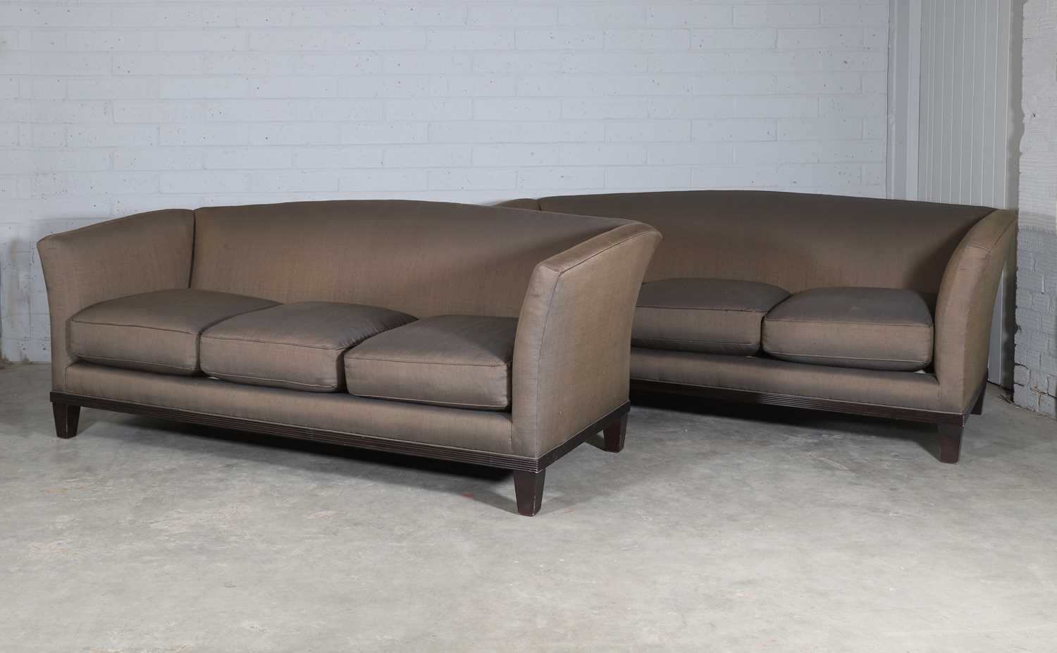 Lot 339 - A pair of three-seater sofas,