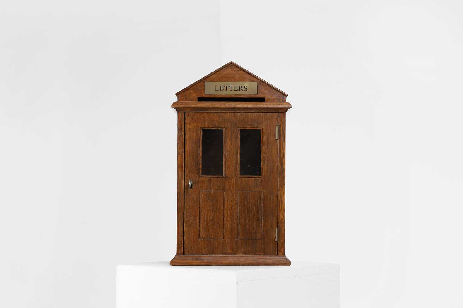 Lot 100 - An oak letter box,