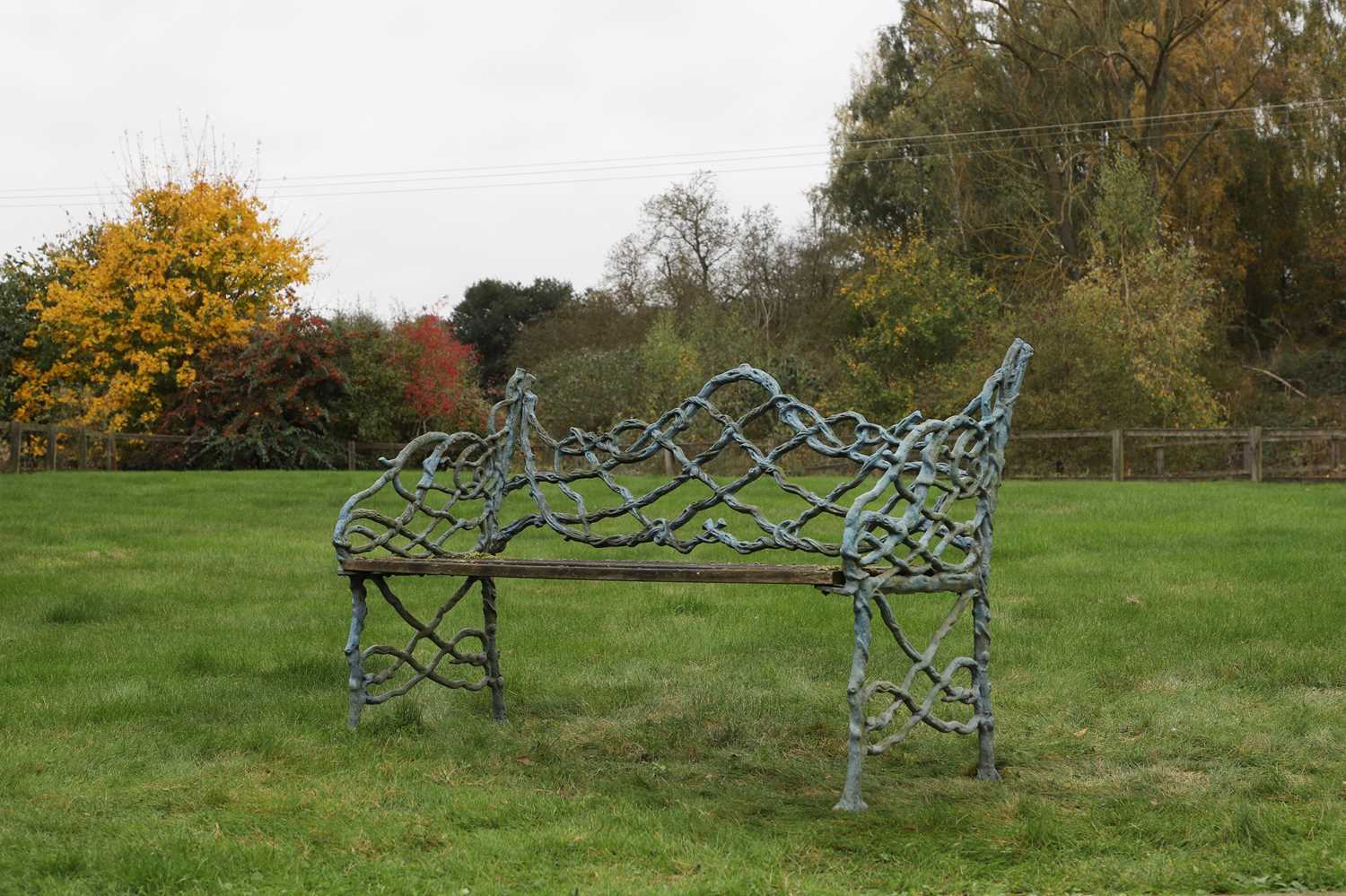 Lot 642 - A Victorian painted cast iron garden bench,