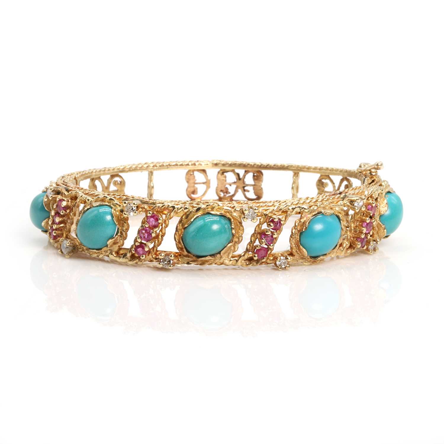 Lot 300 - A turquoise, ruby and diamond hinged bangle,