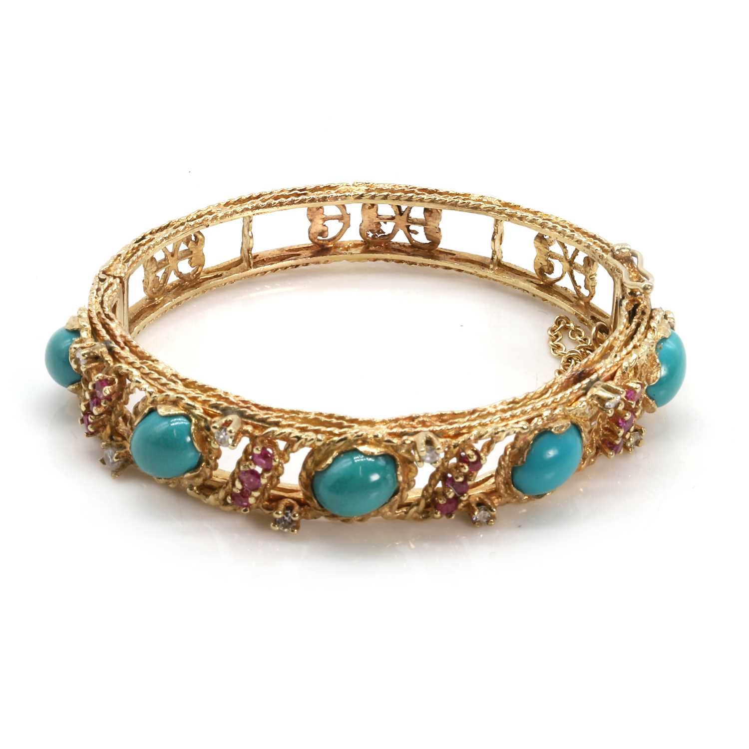 Lot 300 - A turquoise, ruby and diamond hinged bangle,