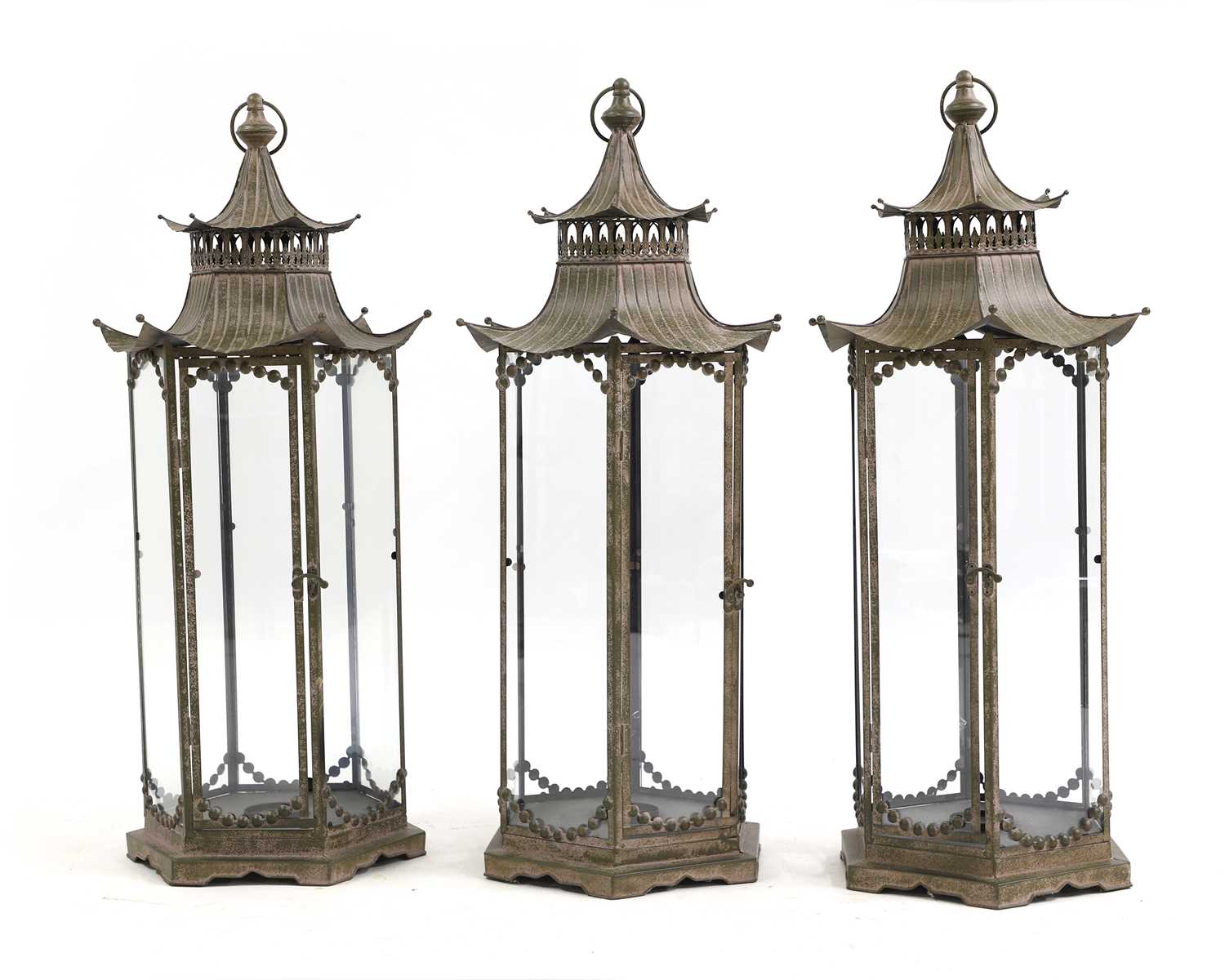 Lot 616 - A set of three aged metal lanterns,
