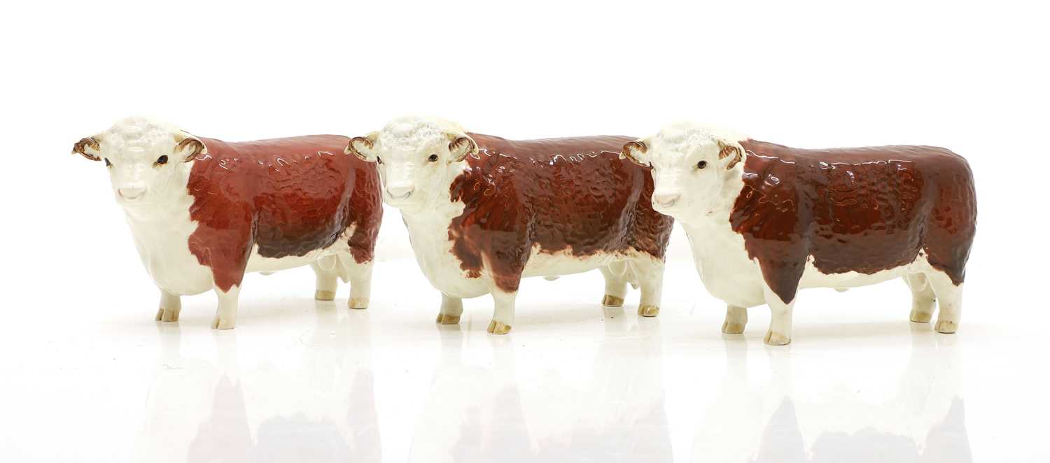 Lot 234 - Three Beswick pottery Hereford bulls,