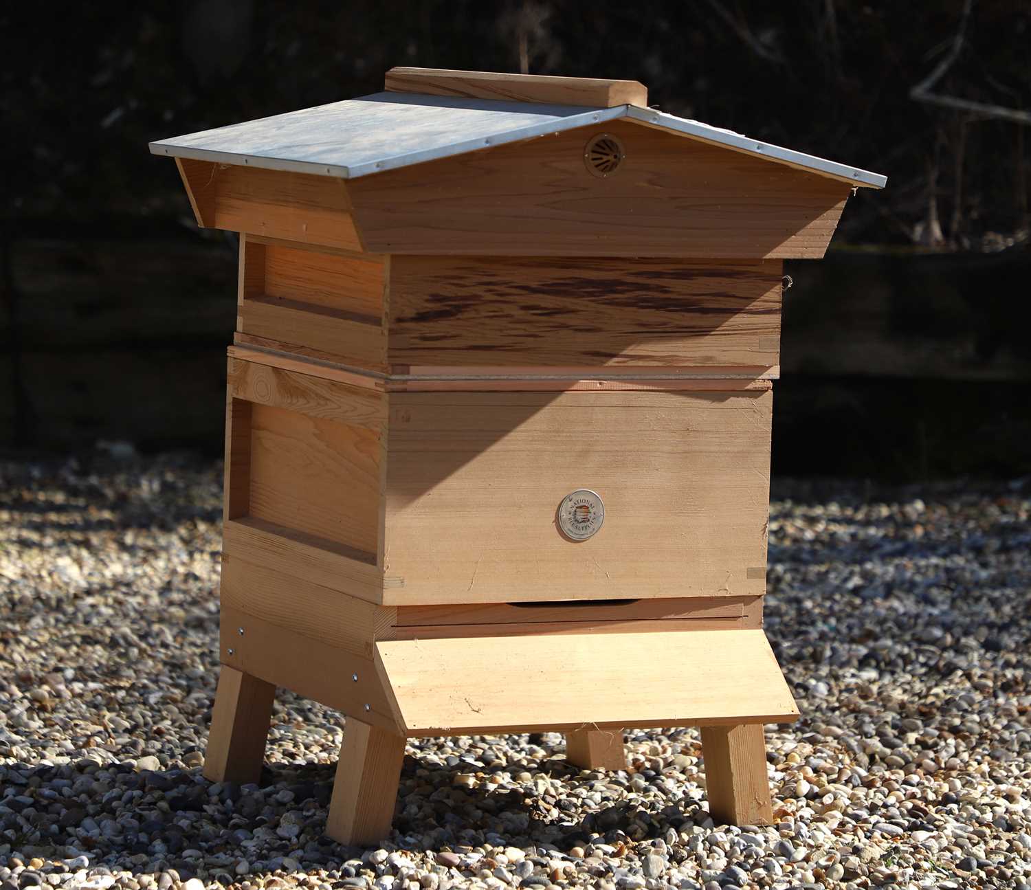 Lot 686 - A National cedar beehive by National Bee