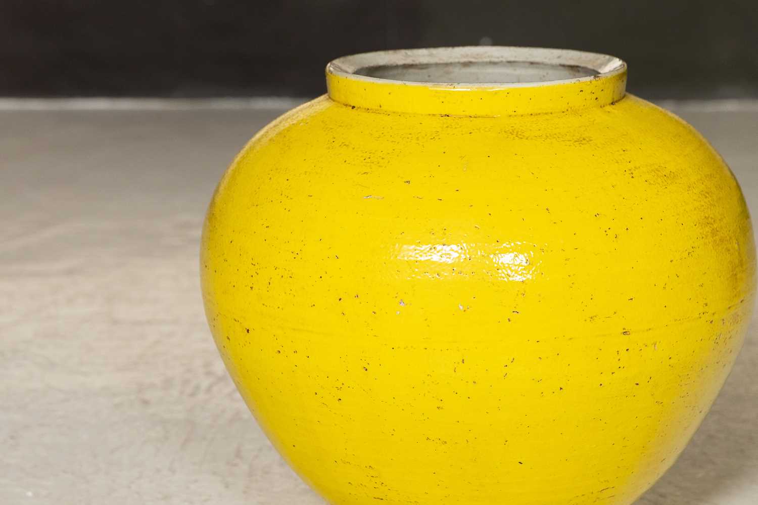Lot 173 - A yellow-glazed stoneware jar,