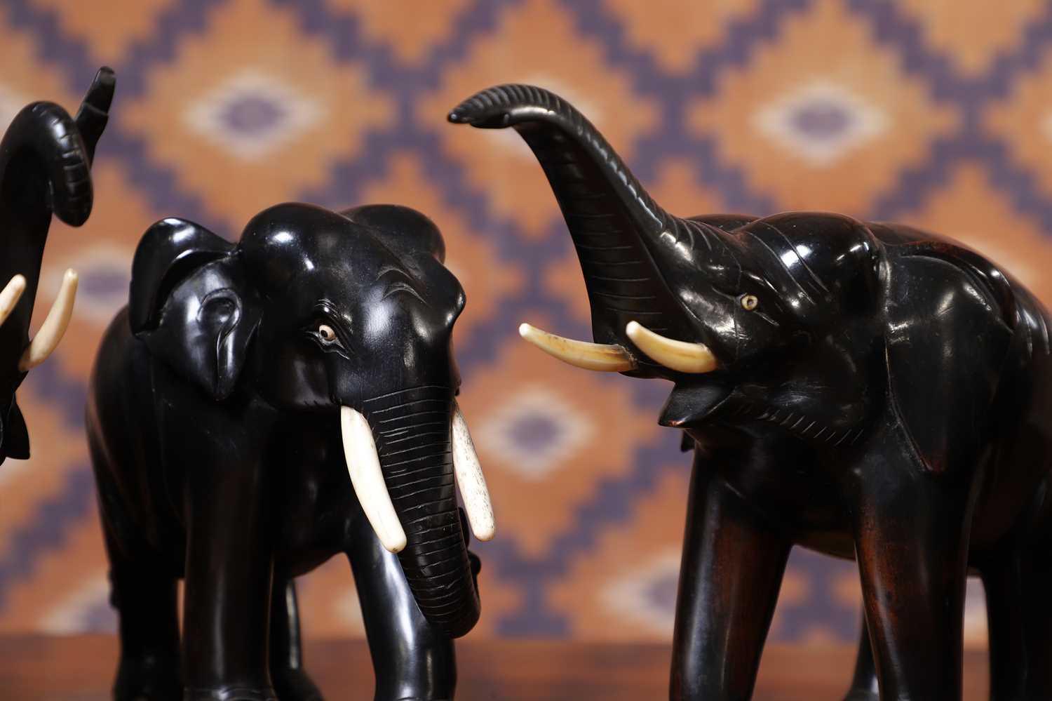 Lot 428 - A collection of ebony elephants,