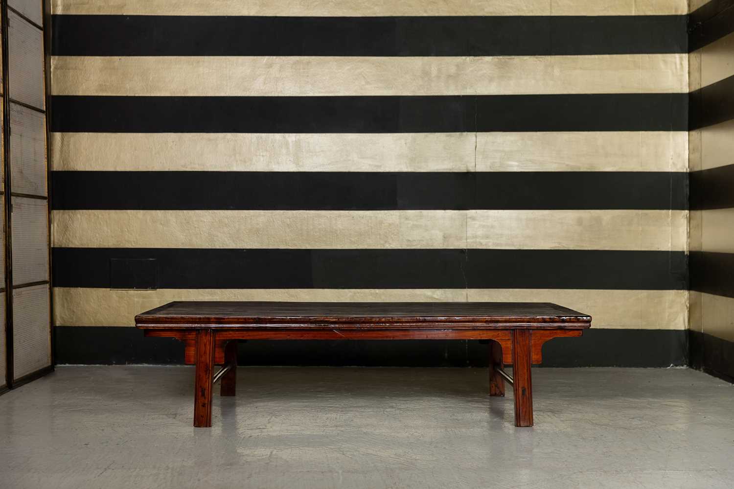 Lot 185 - A stained elm coffee table,