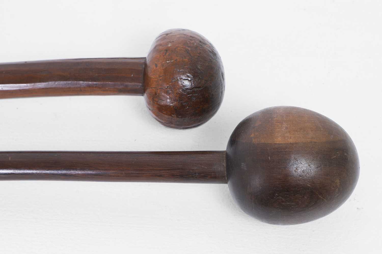 Lot 378 - Two wooden throwing clubs (i ula kitu),