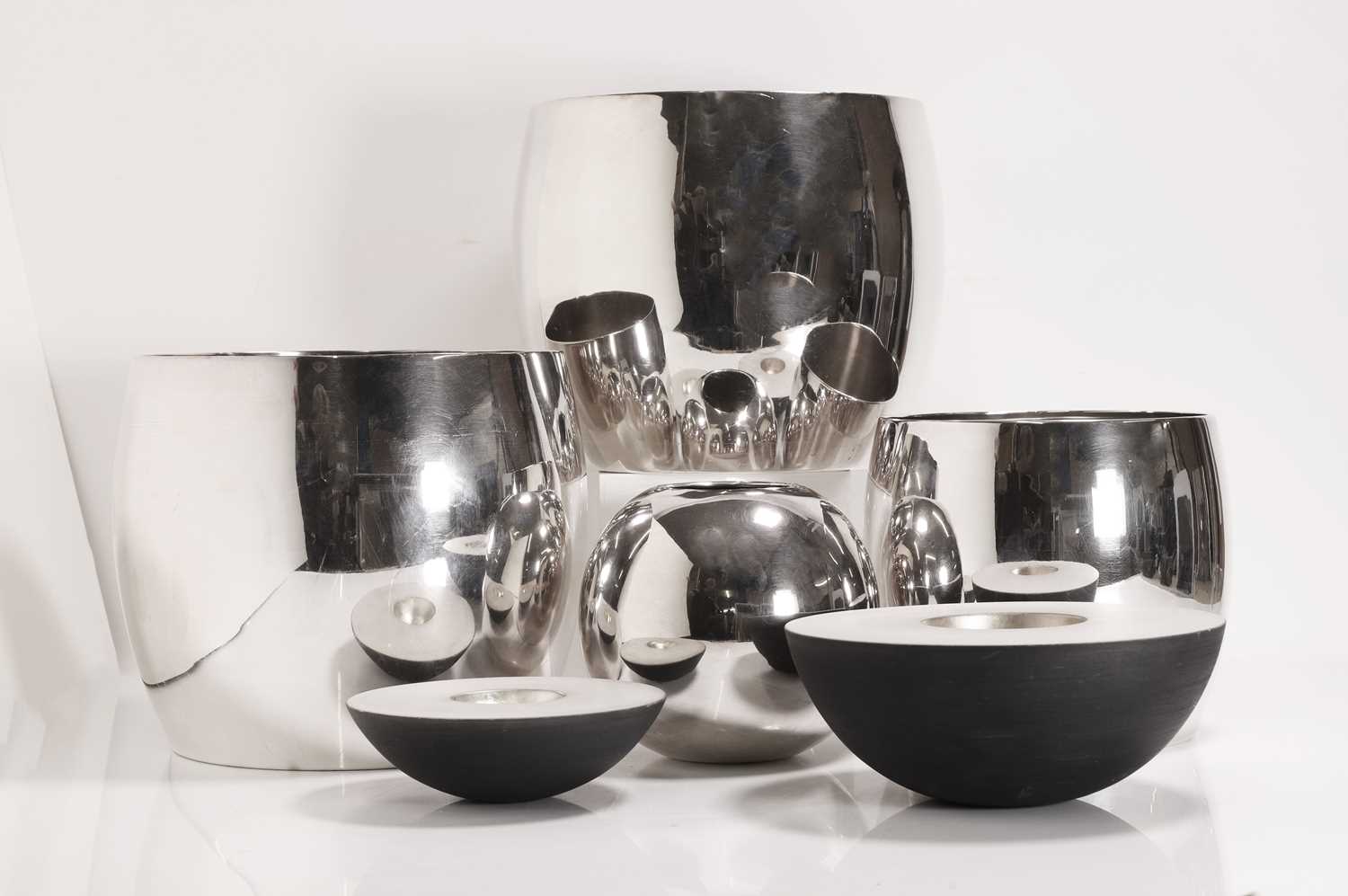 Lot 421 - A set of three graduated silver-plated vases,