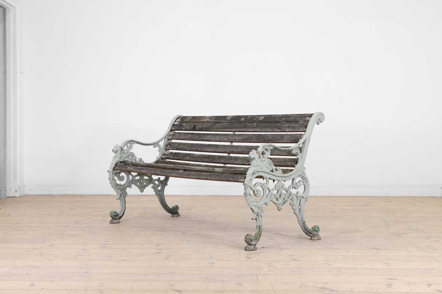 Lot 707 - A Victorian painted cast iron garden bench,