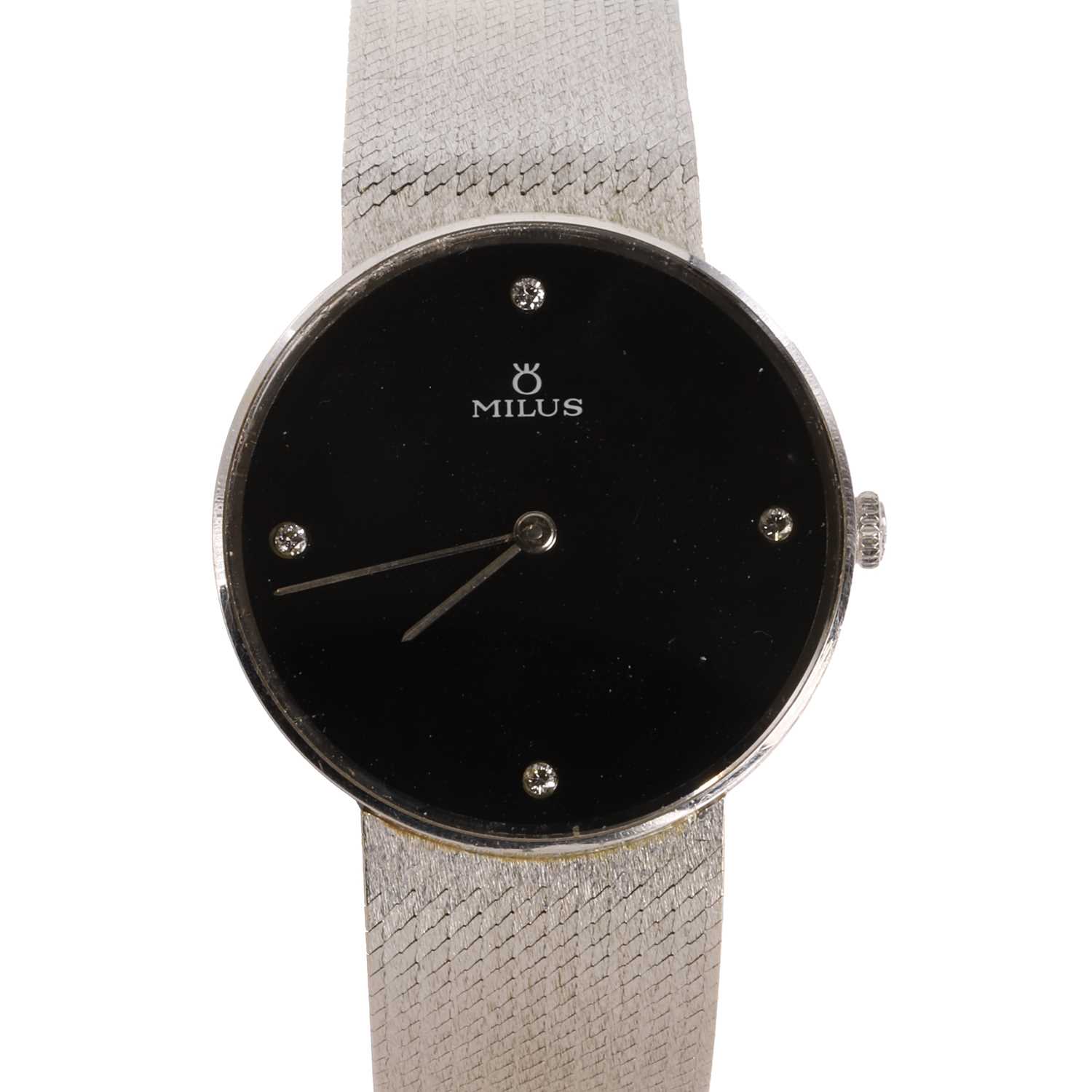 Lot 365 - An 18ct white gold Milus mechanical bracelet