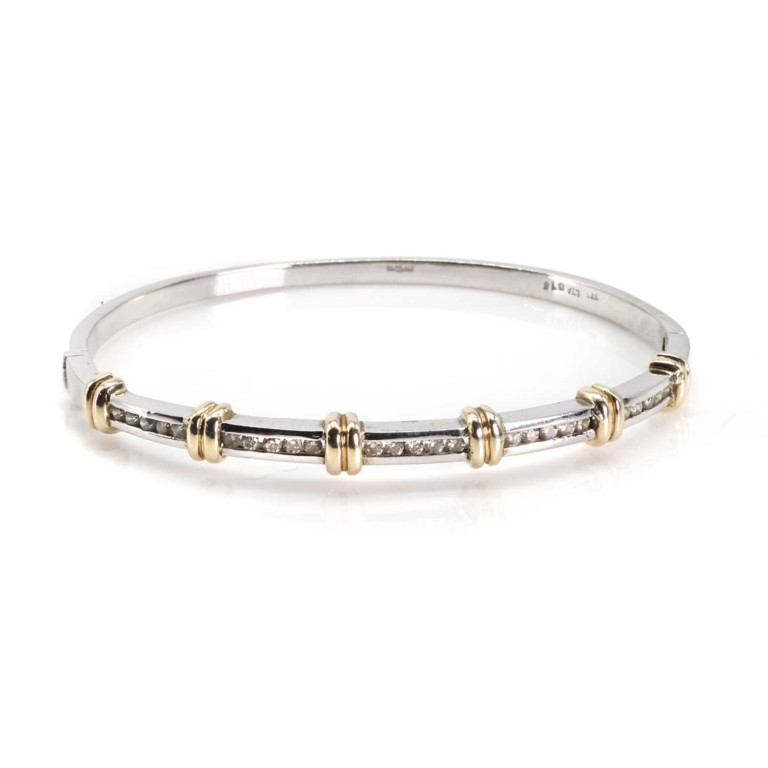 Lot 113 - A 9ct two colour gold diamond hinged bangle,