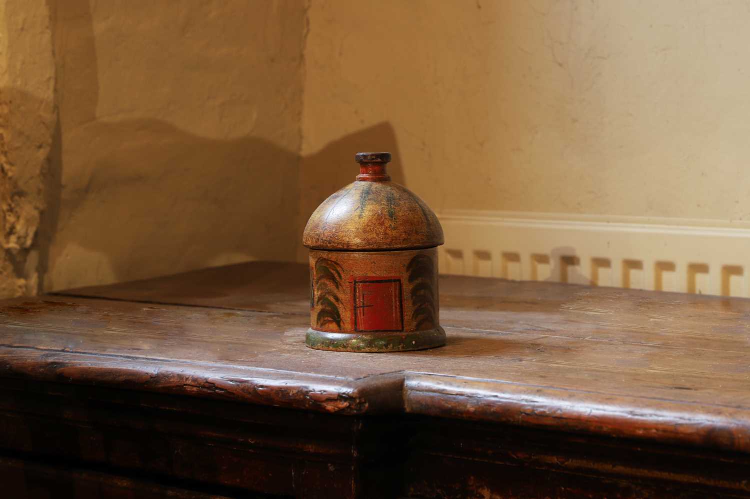 Lot 539 - A naïve treen cottage money bank,