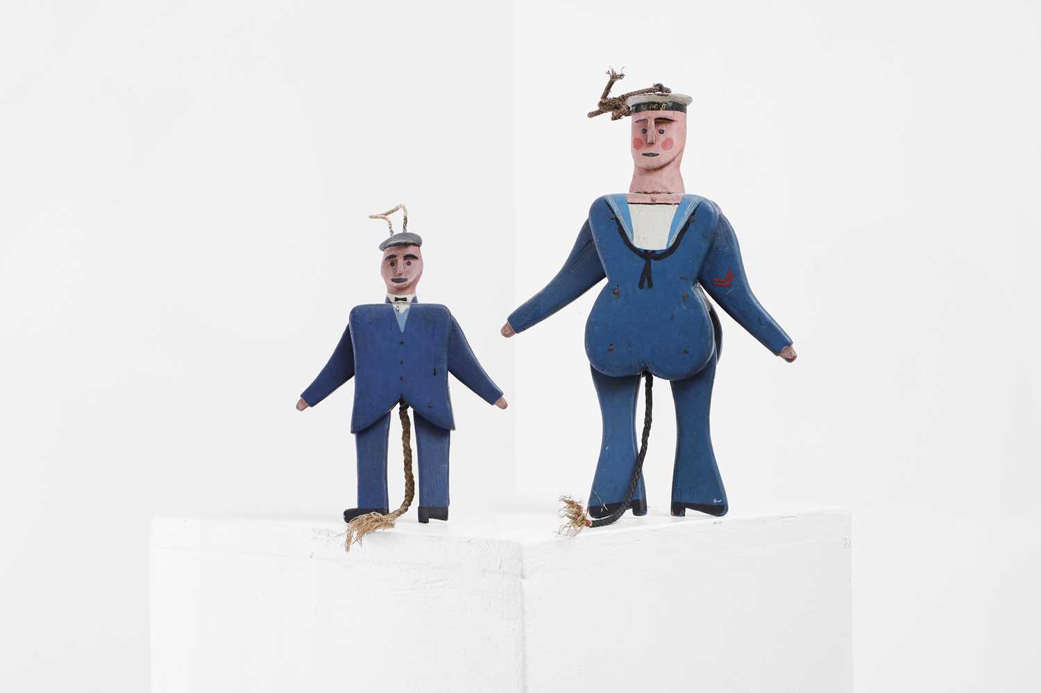 Lot 548 - A naive painted wood toy sailor figure,