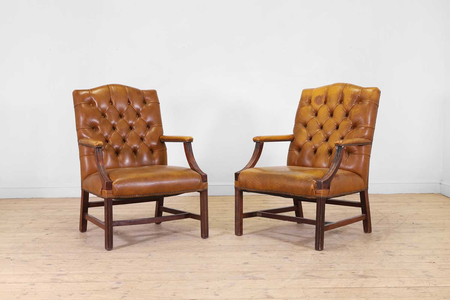 Lot 610 - A pair of George III-style buttoned leather