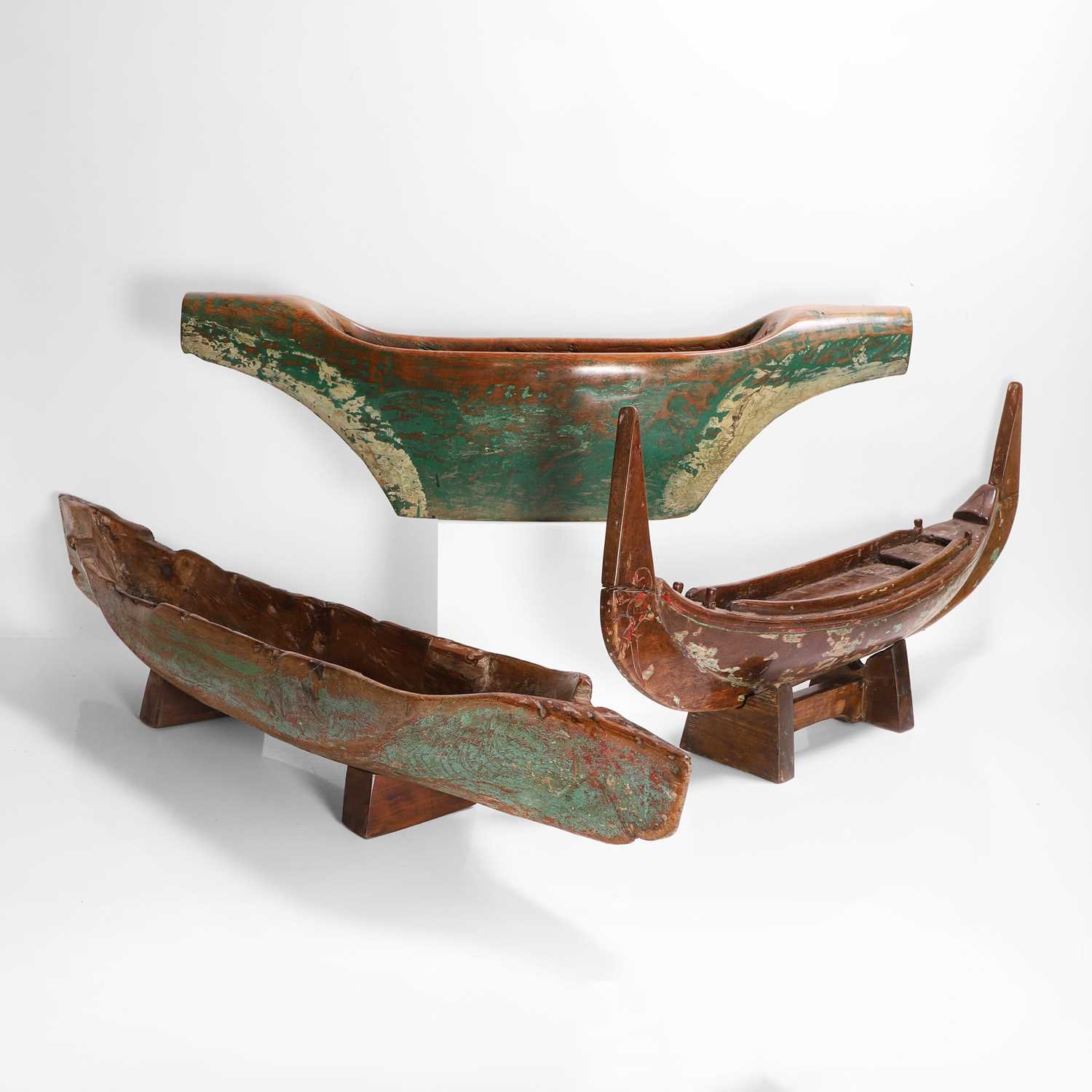 Lot 204 - A group of carved wood boats,
