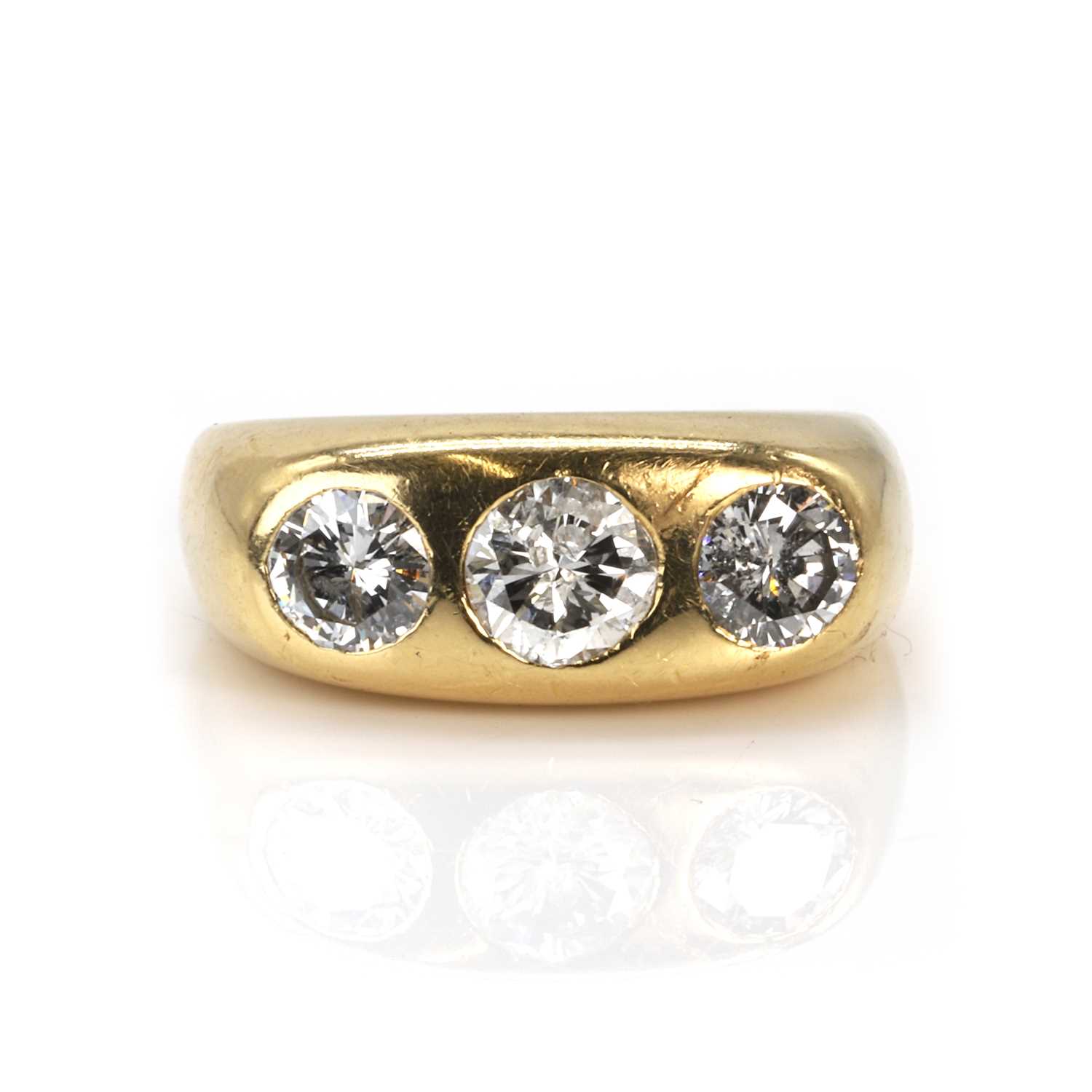 Lot 188 - A gold diamond three stone ring,