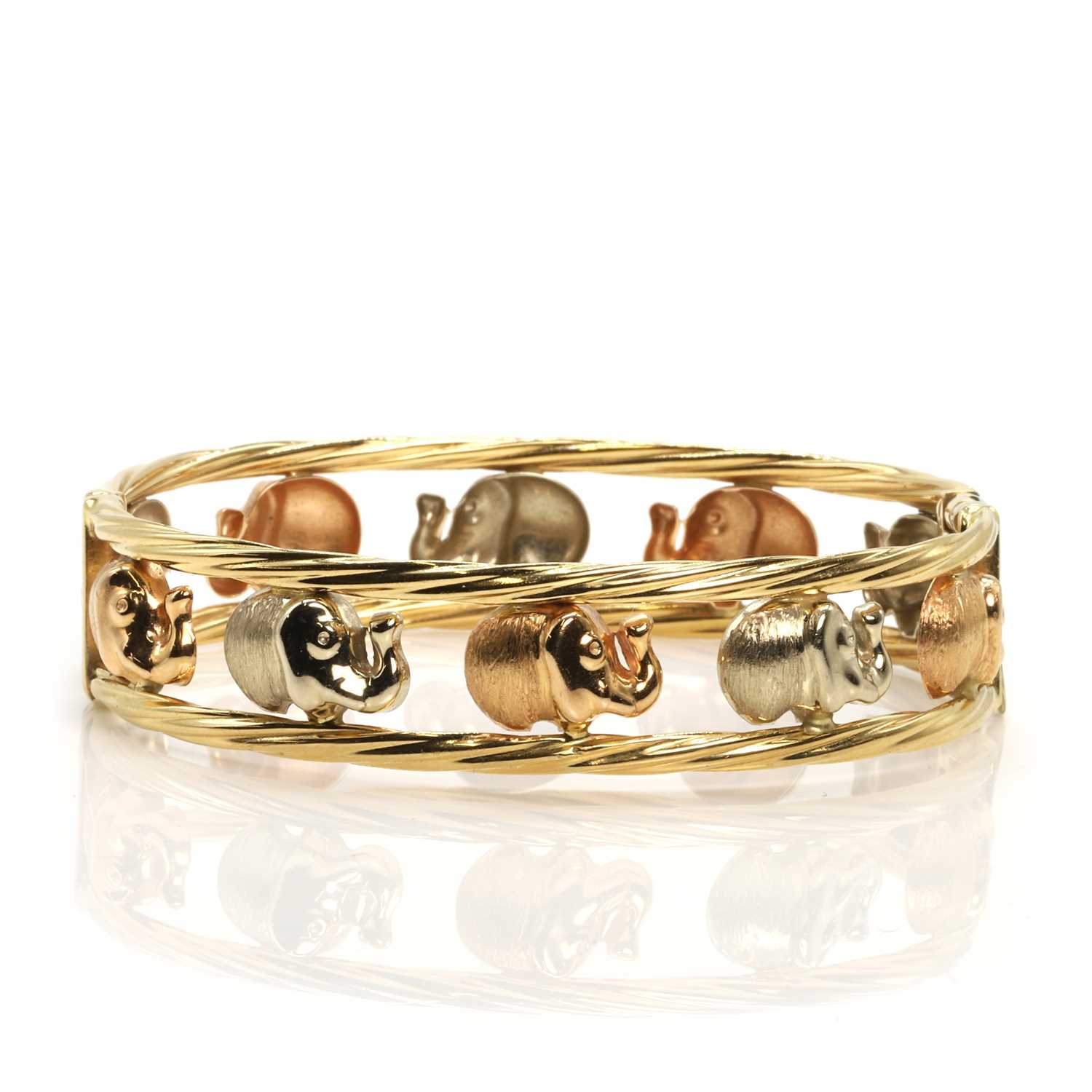 Lot 212 - A bicoloured gold hinged bangle,
