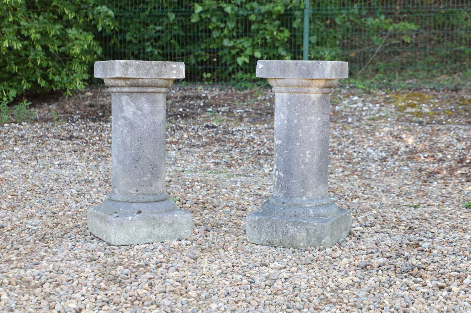 Lot 378 - A pair of round Tuscan cast stone plinths