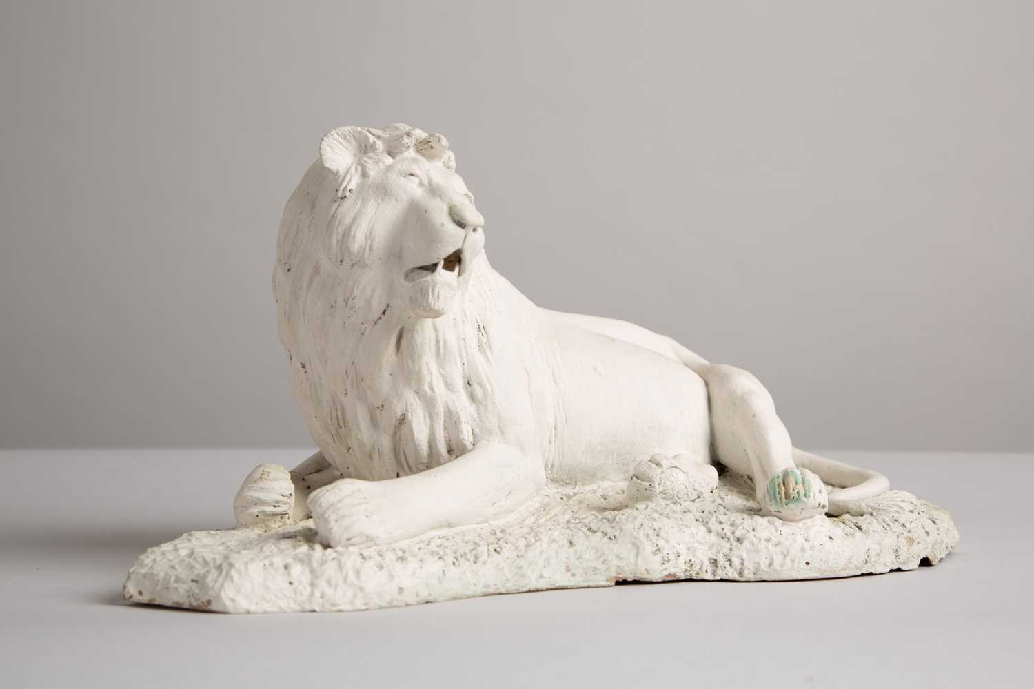 Lot 162 - A collection of four plaster animals,