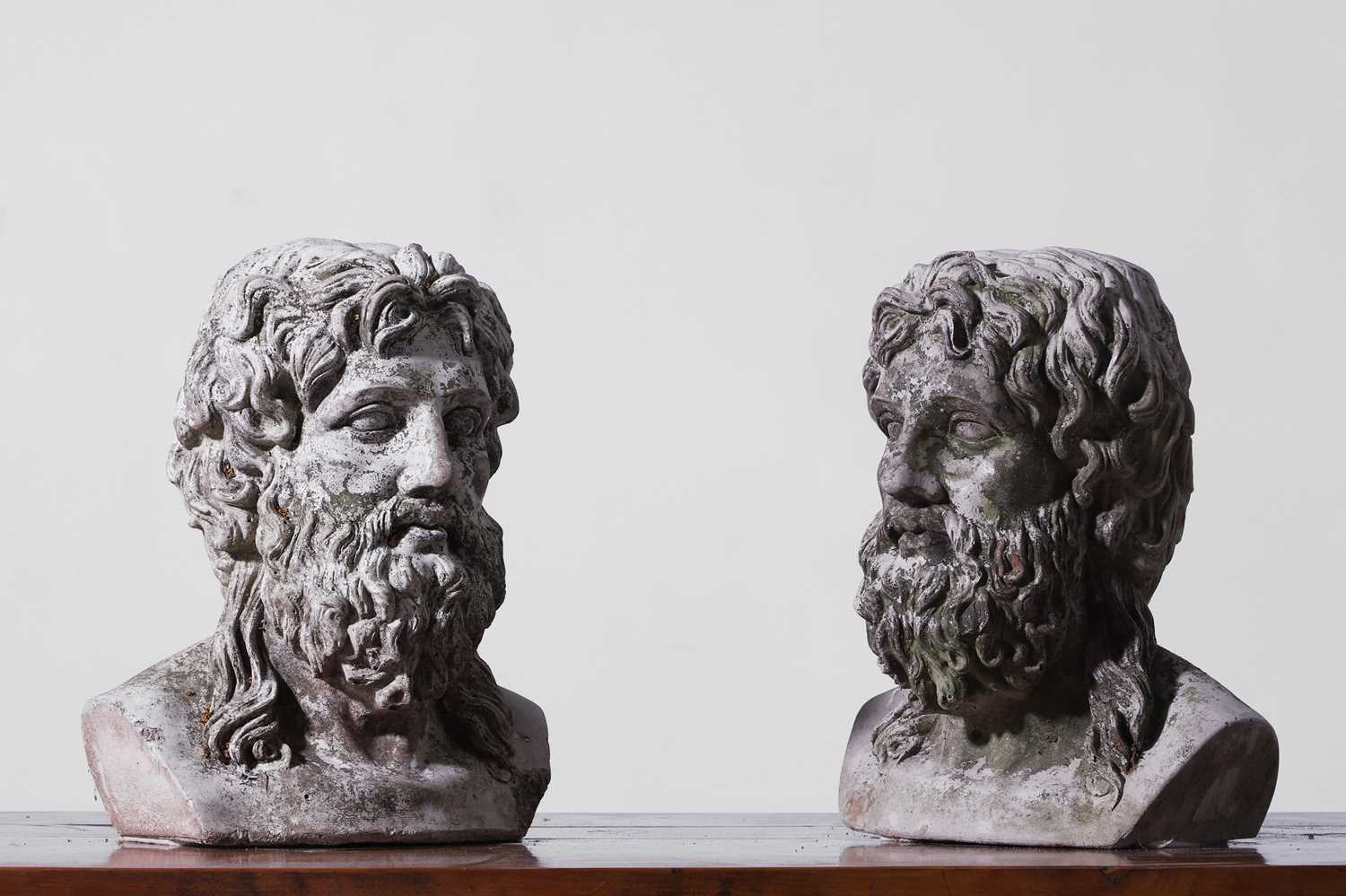 Lot 410 - A pair of painted composition stone busts of