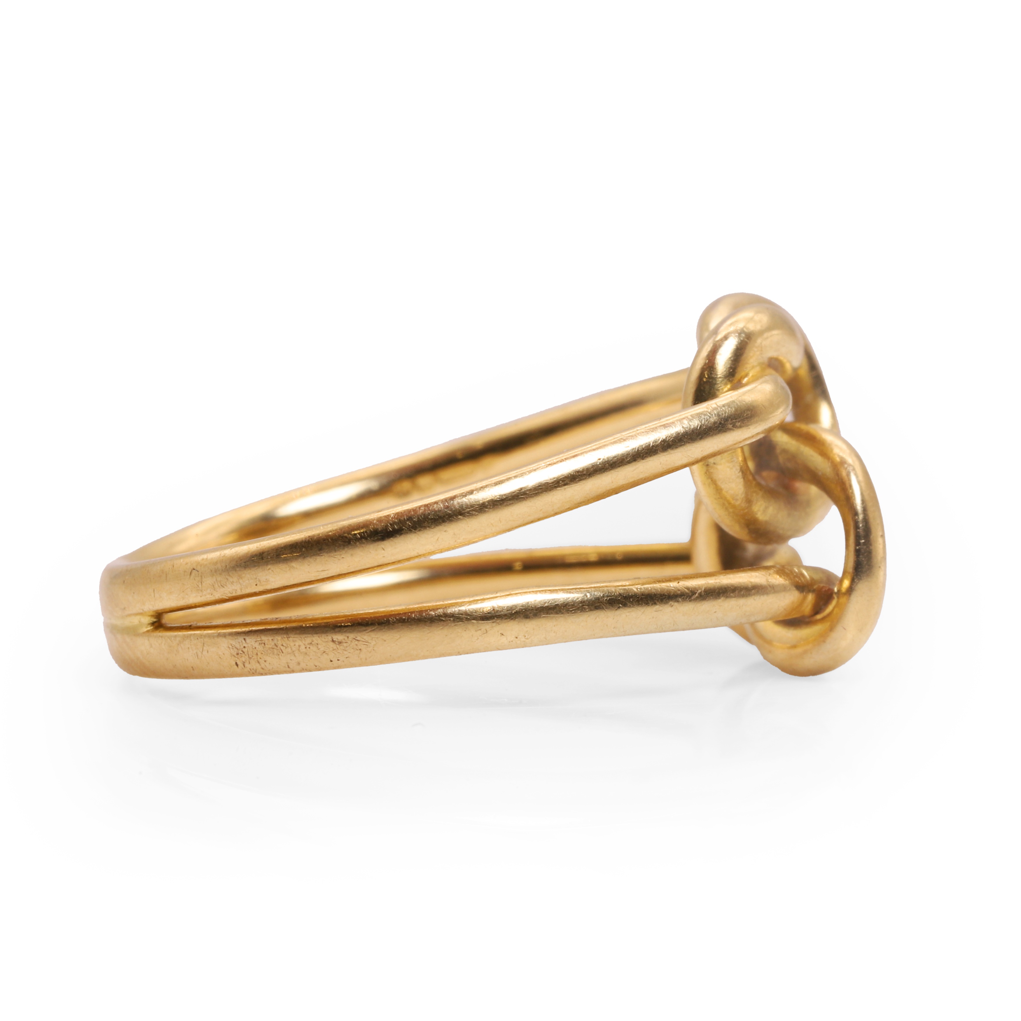 Lot 118 - An 18ct gold knot ring,