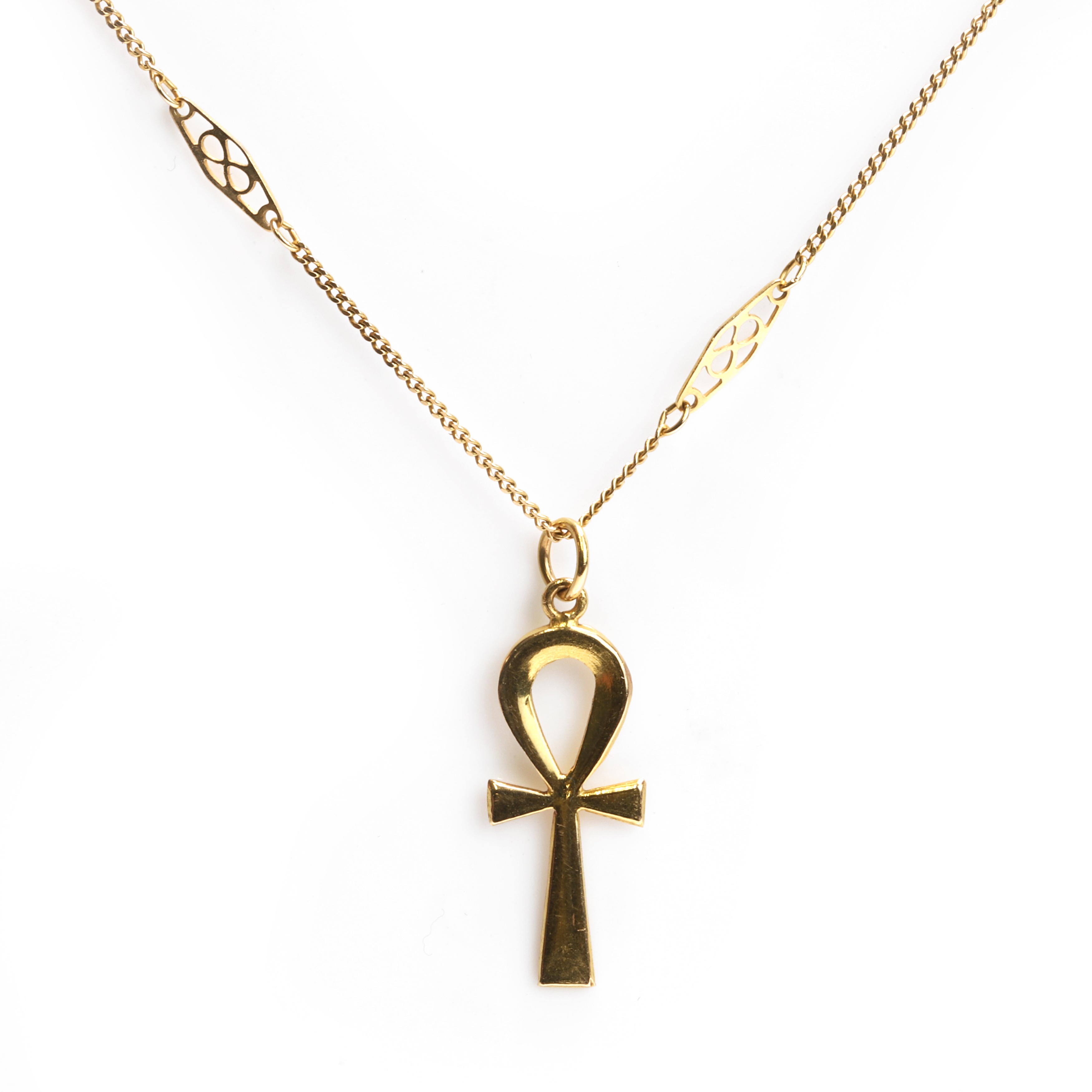 Lot 1069 - A gold ankh pendant,